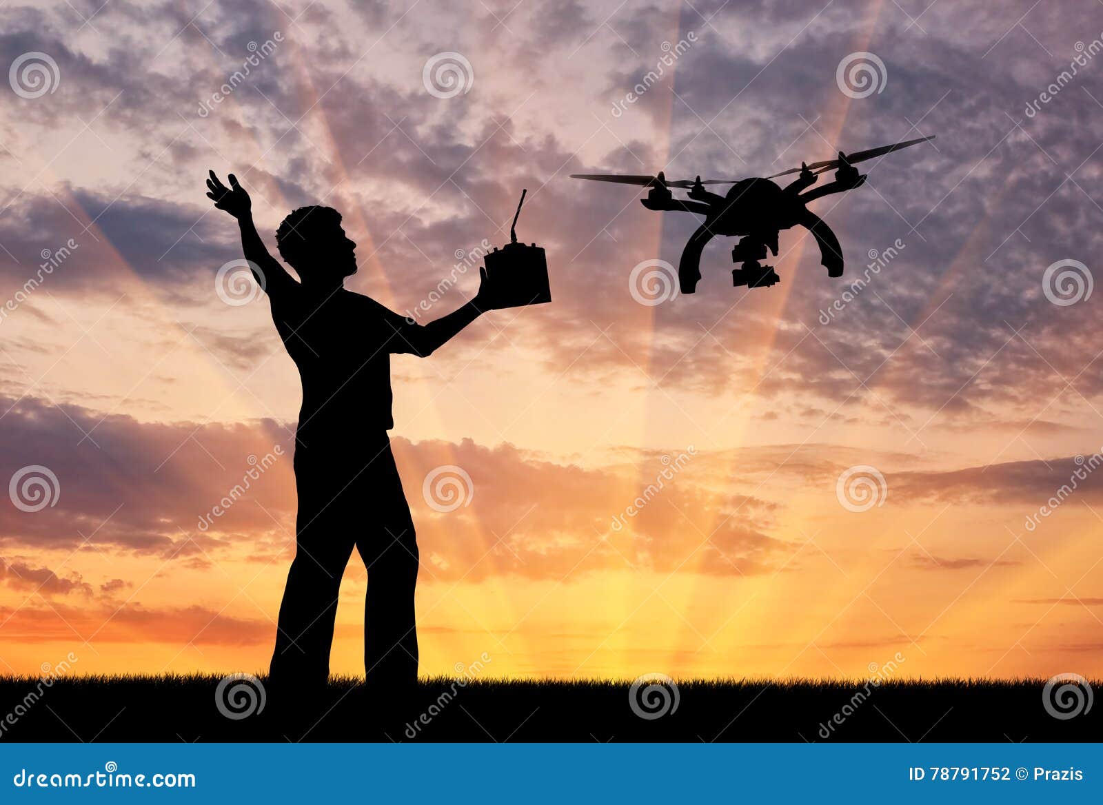 Silhouette of a Flying Drone, and a Man with a Remote Control at Sunset ...