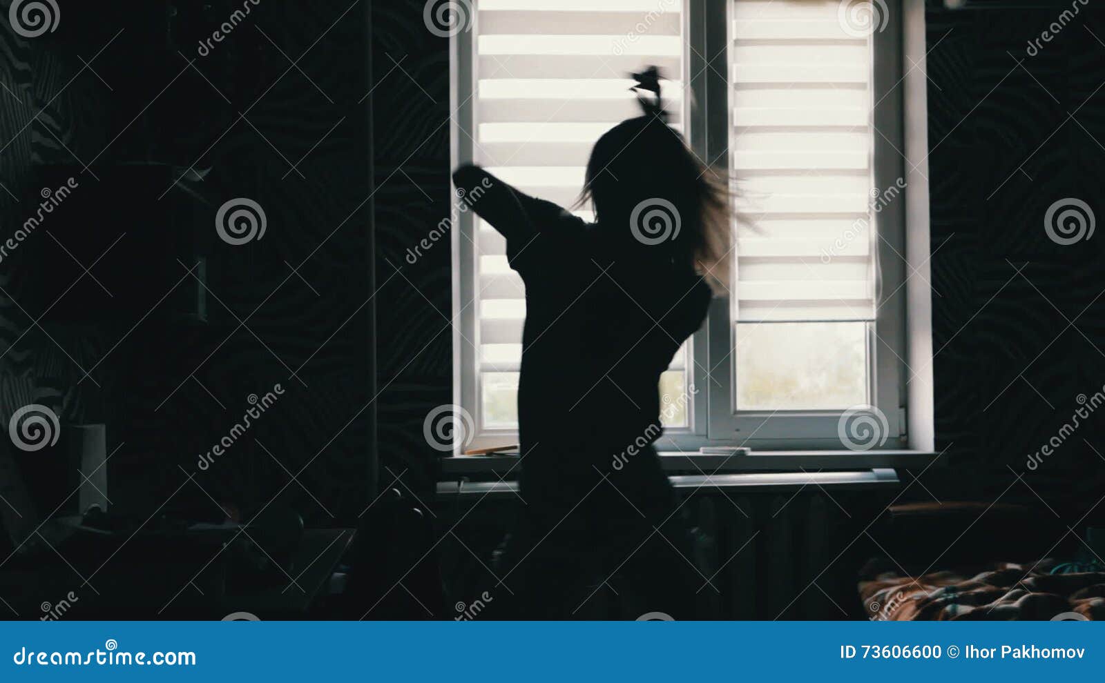 Silhouette of a Girl Dancing in Front of a Window at Home Stock Footage ...
