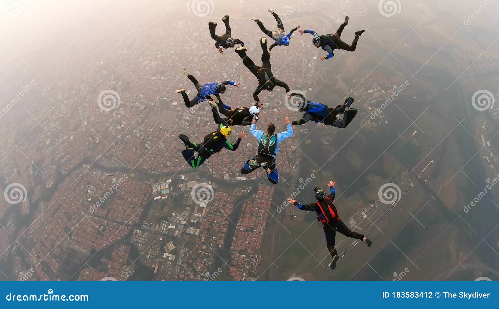 Silhouette of a Group of Skydivers Jumping at the End of the Day. Stock ...