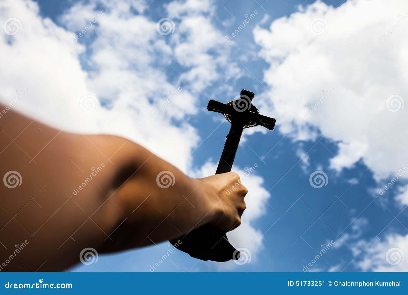 Silhouette of Hand Holding Cross in the Sky, Focus at the Cross Stock ...