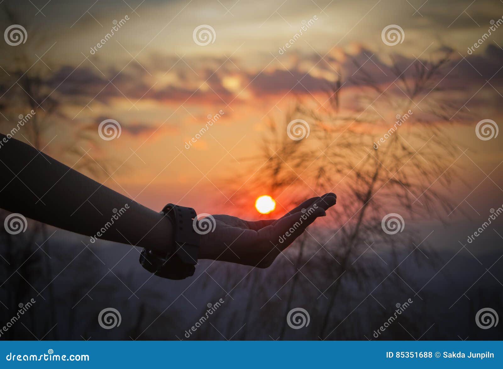 Silhouette of Hand Holding Sun Stock Photo - Image of power, orange ...