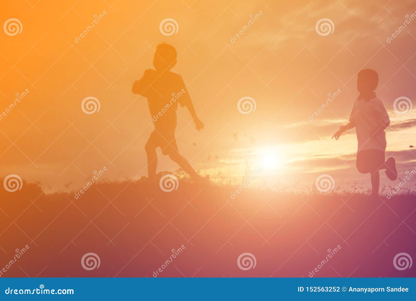 Silhouette of a Happy Children and Happy Time Sunset Stock Photo ...