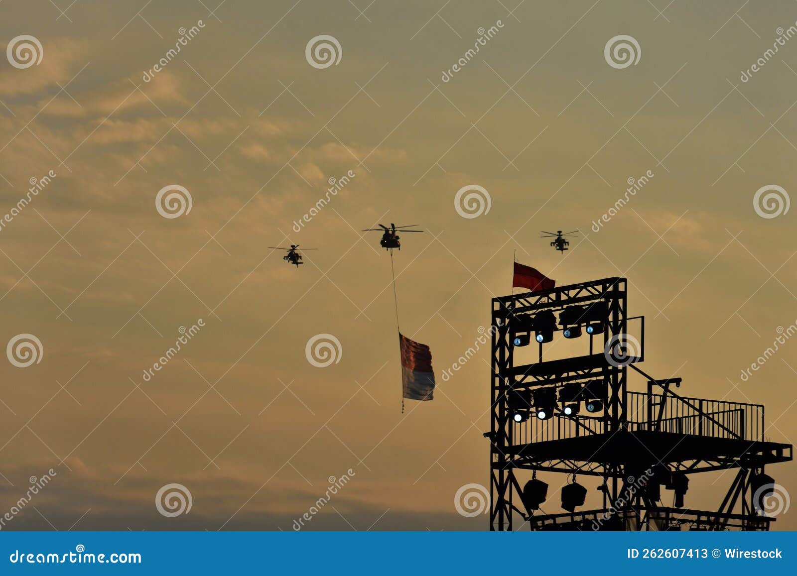Silhouette of Helicopters Flying Over Lighting Equipment Stock Image ...