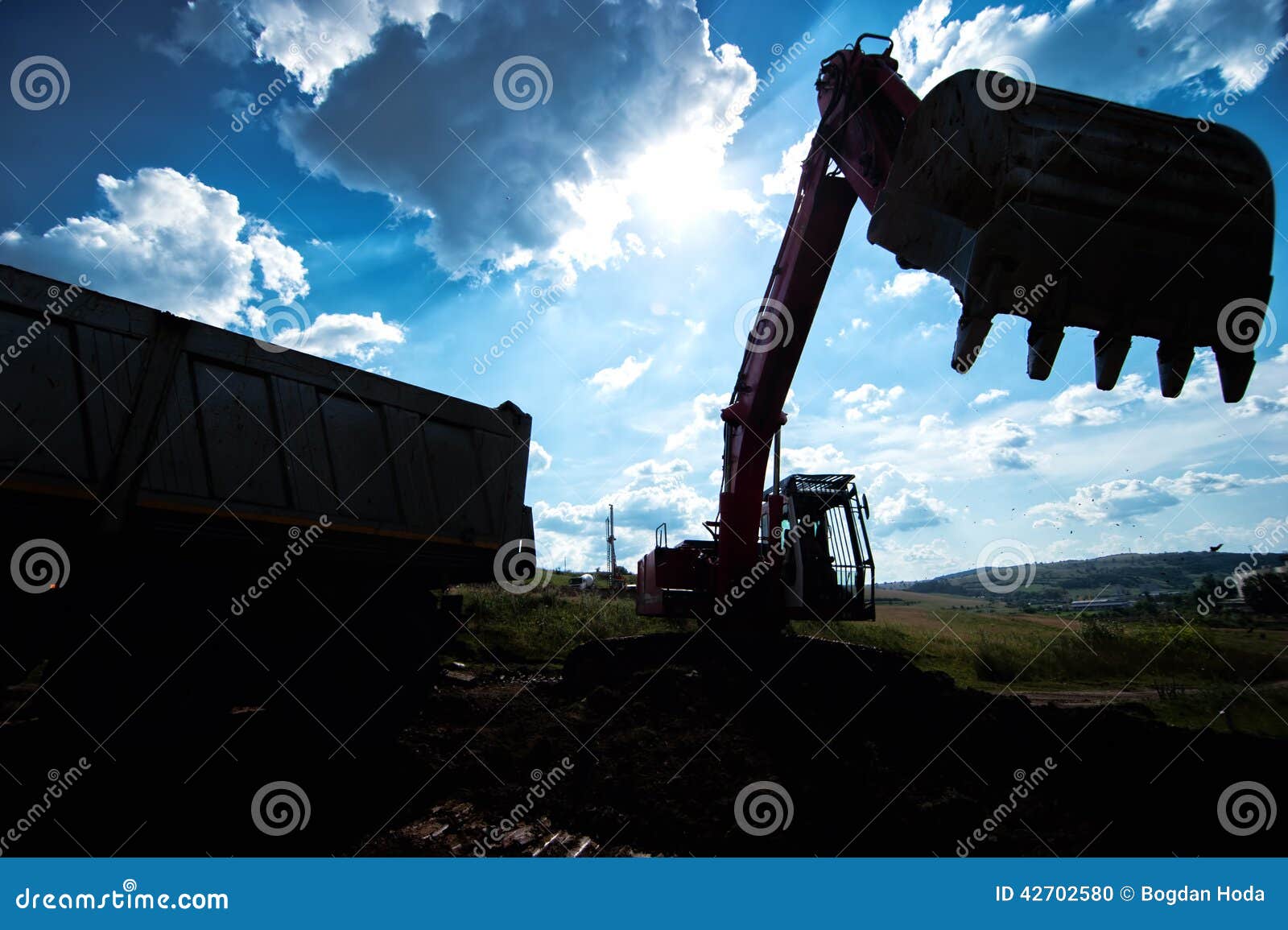 Silhouette of Industrial Excavator Loading Earth Stock Photo - Image of ...