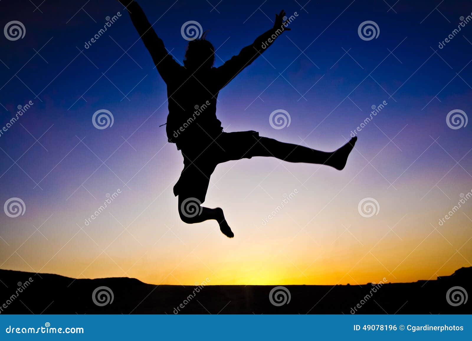 Silhouette Jumping in Front of the Setting Sun Stock Photo - Image of ...