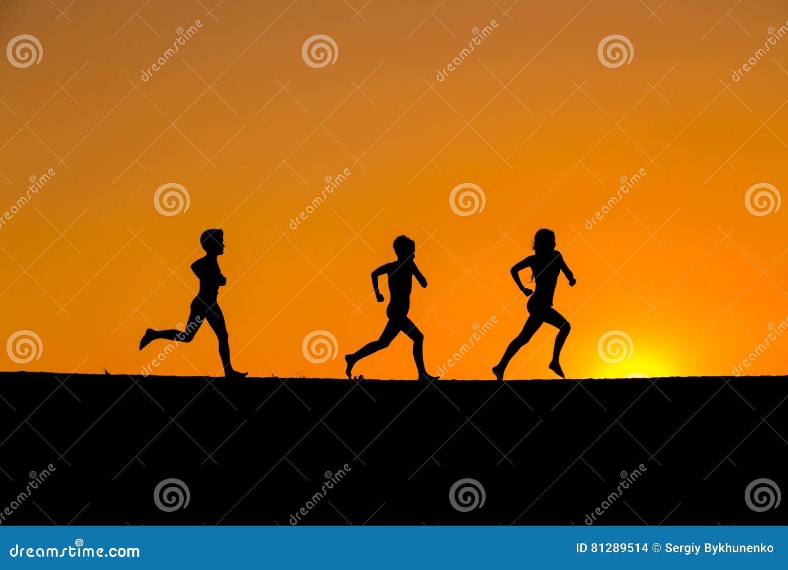 Silhouette of Kids Running Against Sunset Stock Photo - Image of ...