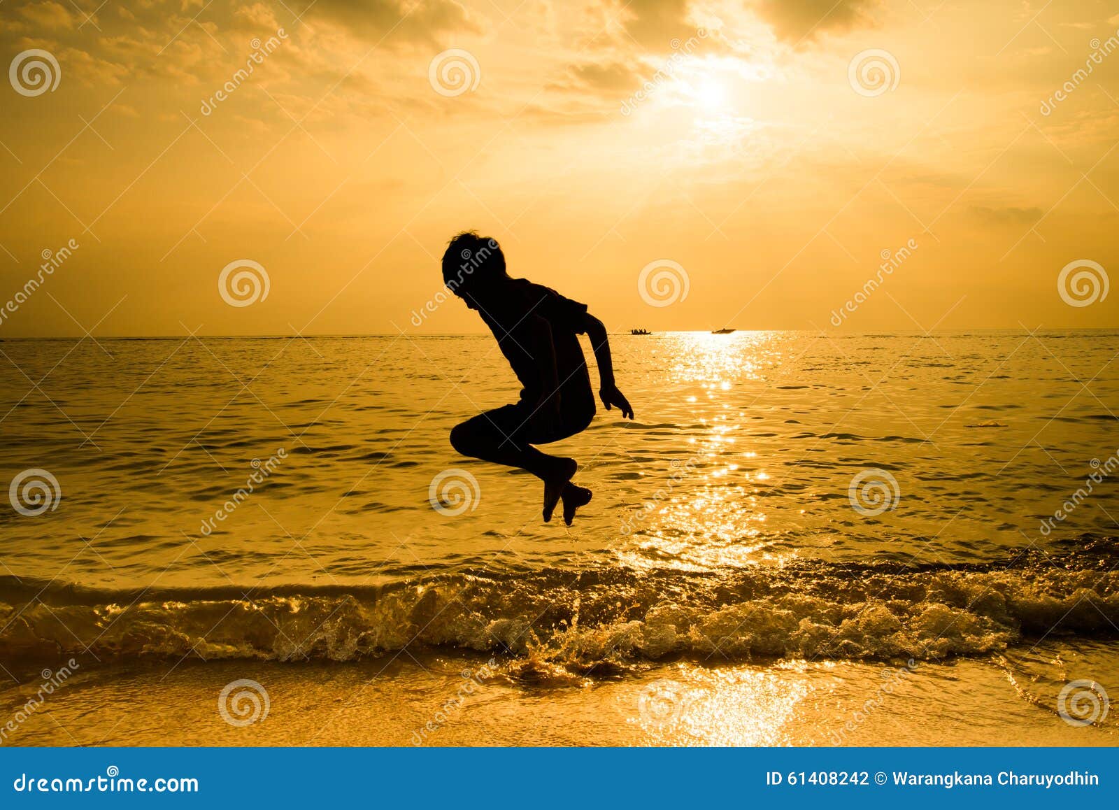 Silhouette of Little Boy Jumping Over Stock Photo - Image of beach ...