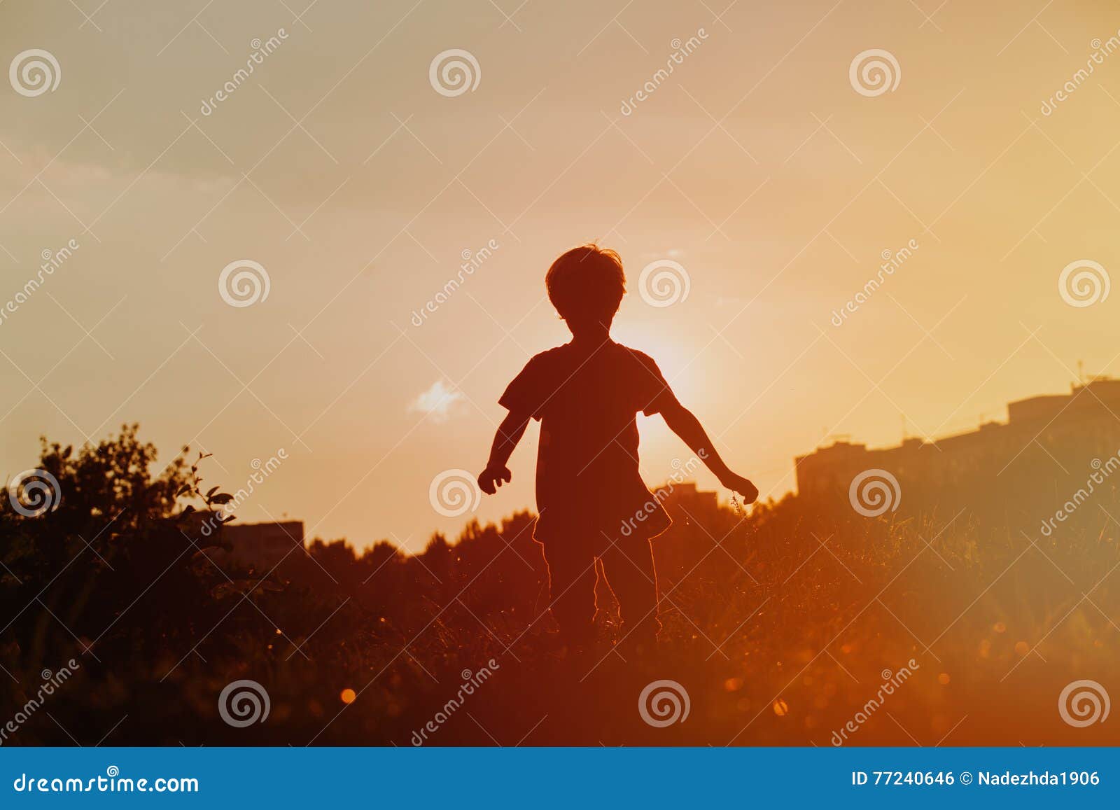 Silhouette of Little Boy Running at Sunset Stock Photo - Image of ...