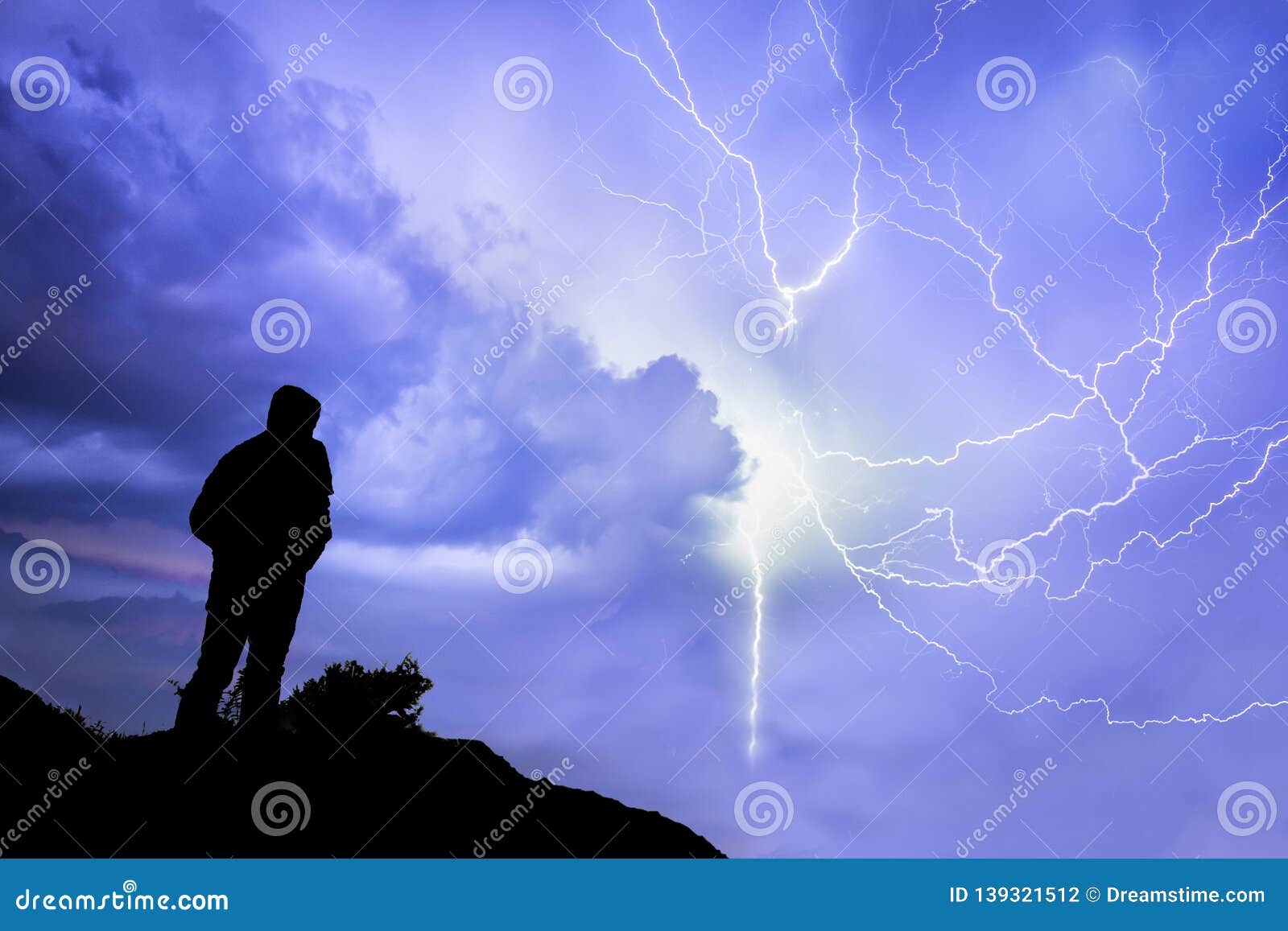 Silhouette of a Man Against a Lightning Storm Stock Photo - Image of ...