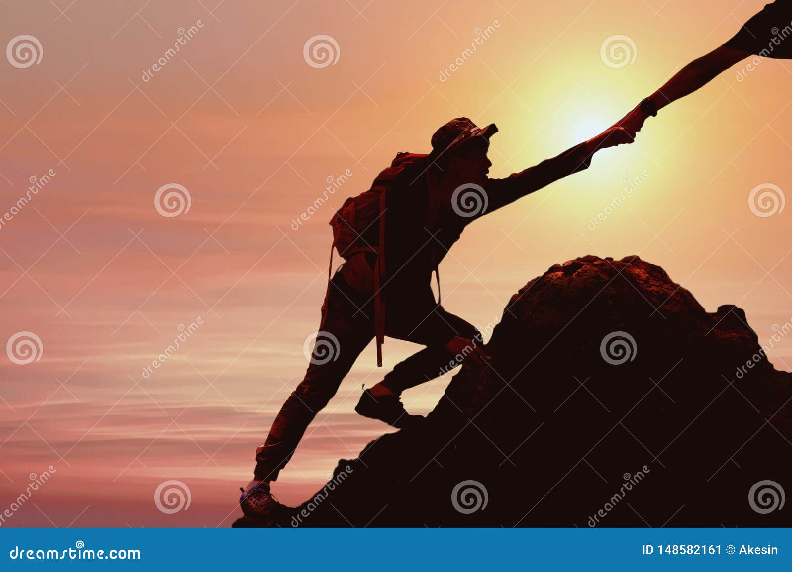 Silhouette of a Man Climbing Up Mountain with Helping Hand Stock Image ...