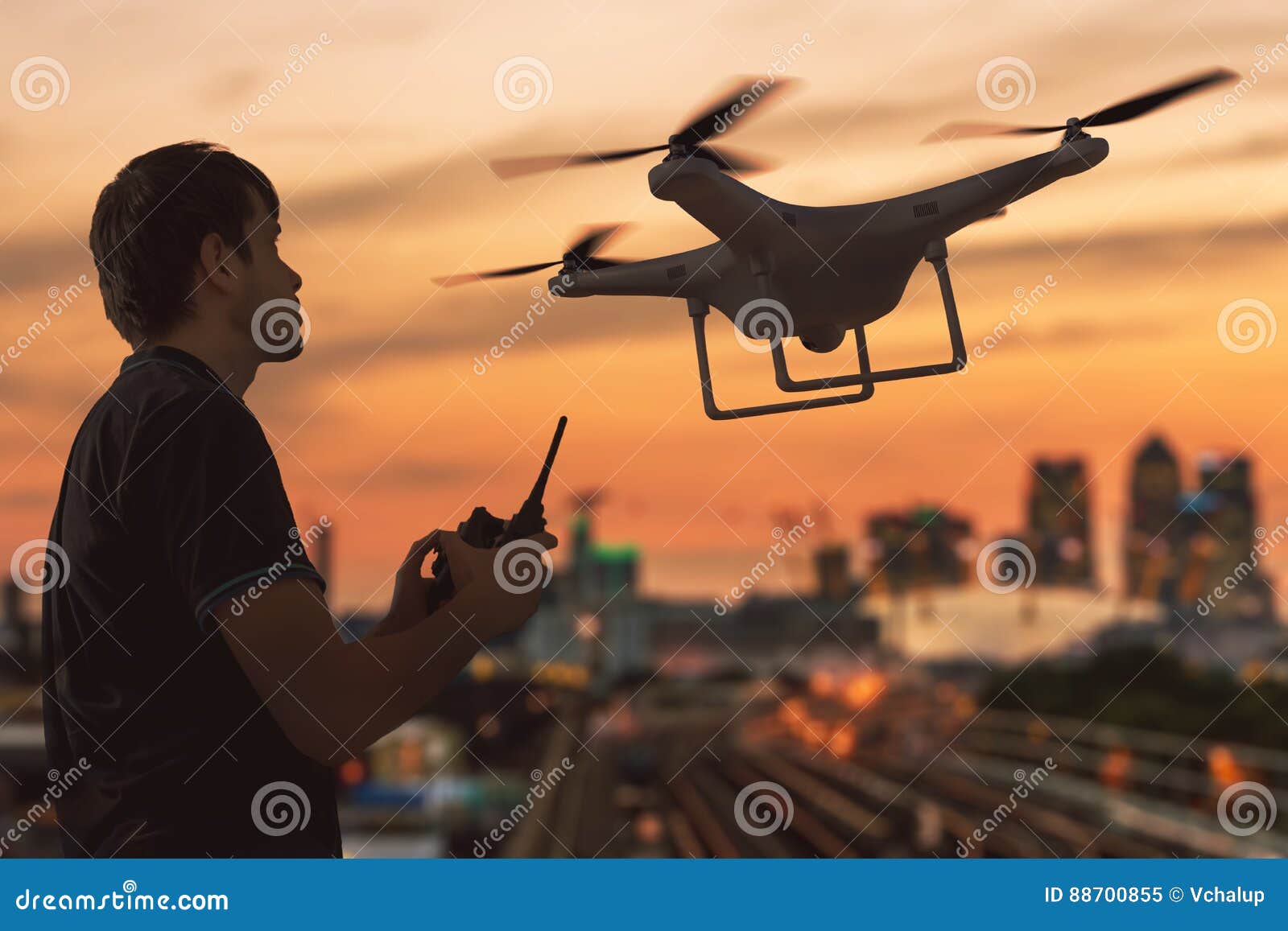 Silhouette of a Man Controlling Flying Drone. 3D Rendered Illustion of ...