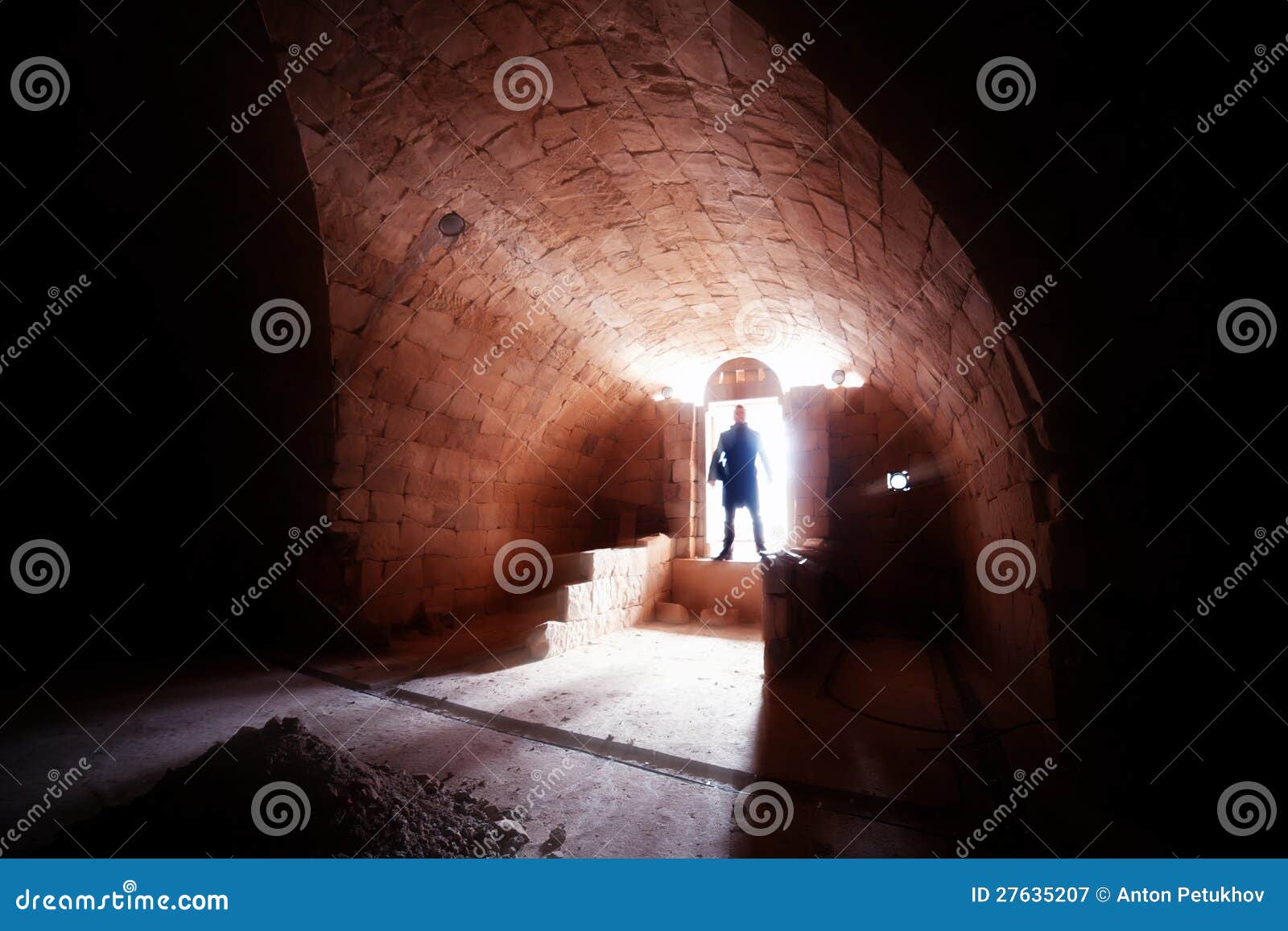Silhouette of man in crypt stock image. Image of cement - 27635207