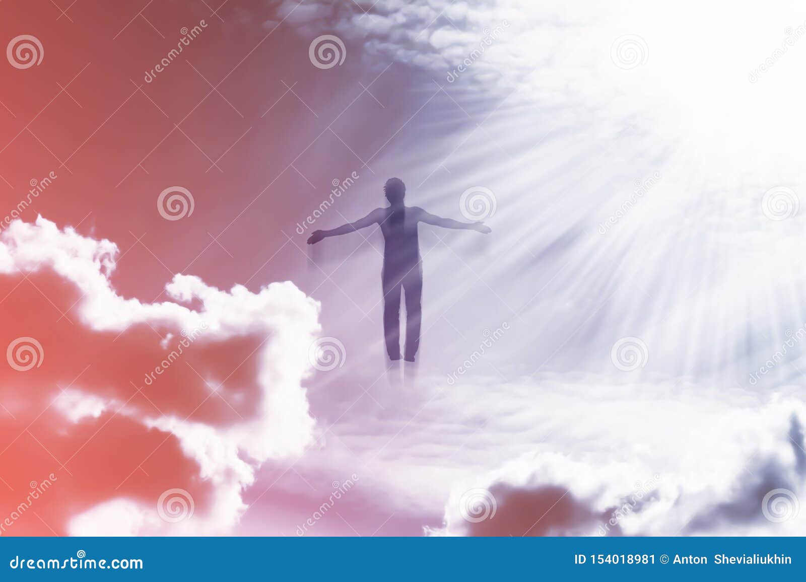 Silhouette of a Man Flying Up in the Sky in the Bright Rays of the Sun ...