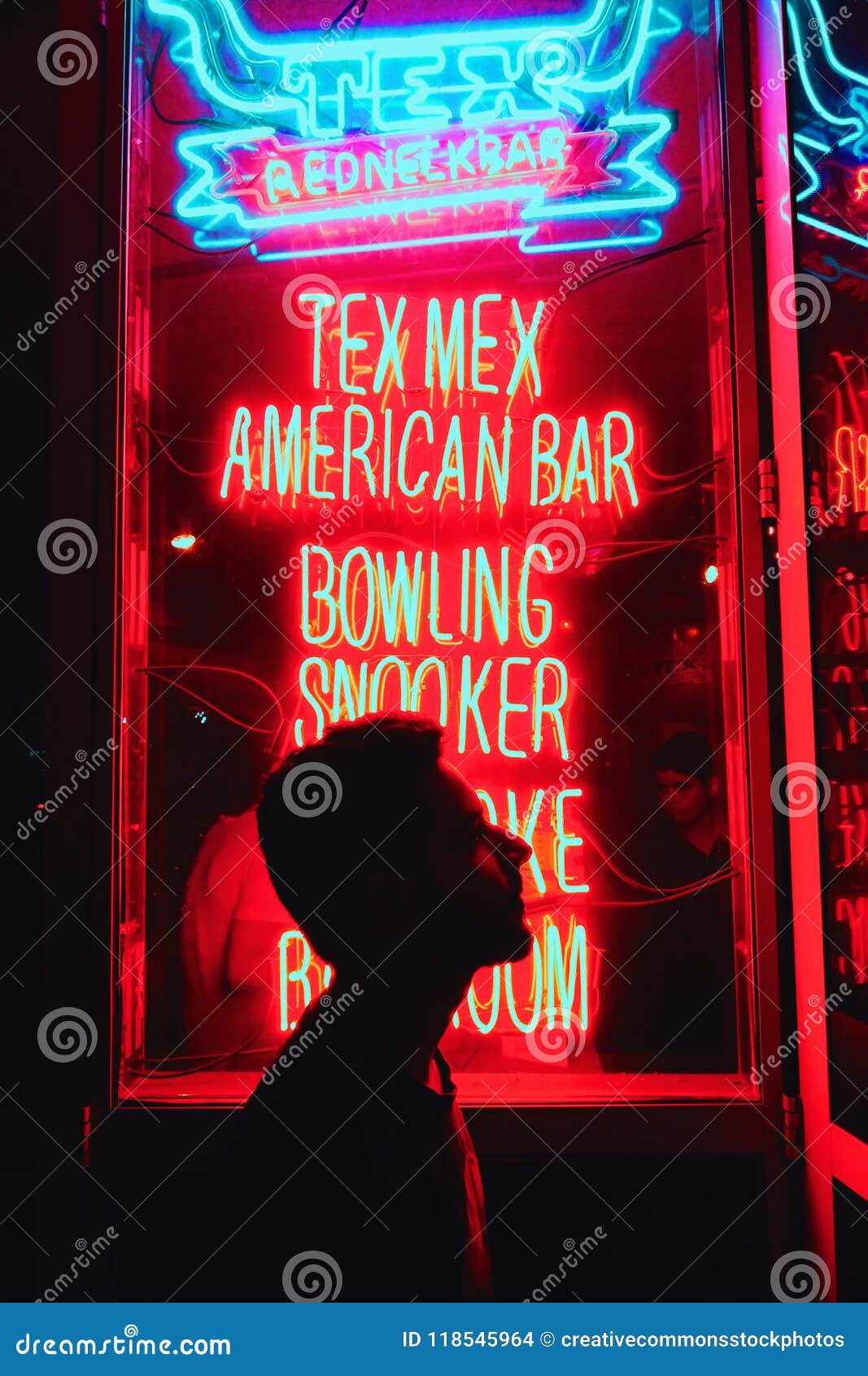 Silhouette Of Man In Front Of Red And Blue Led Light Signage Picture ...