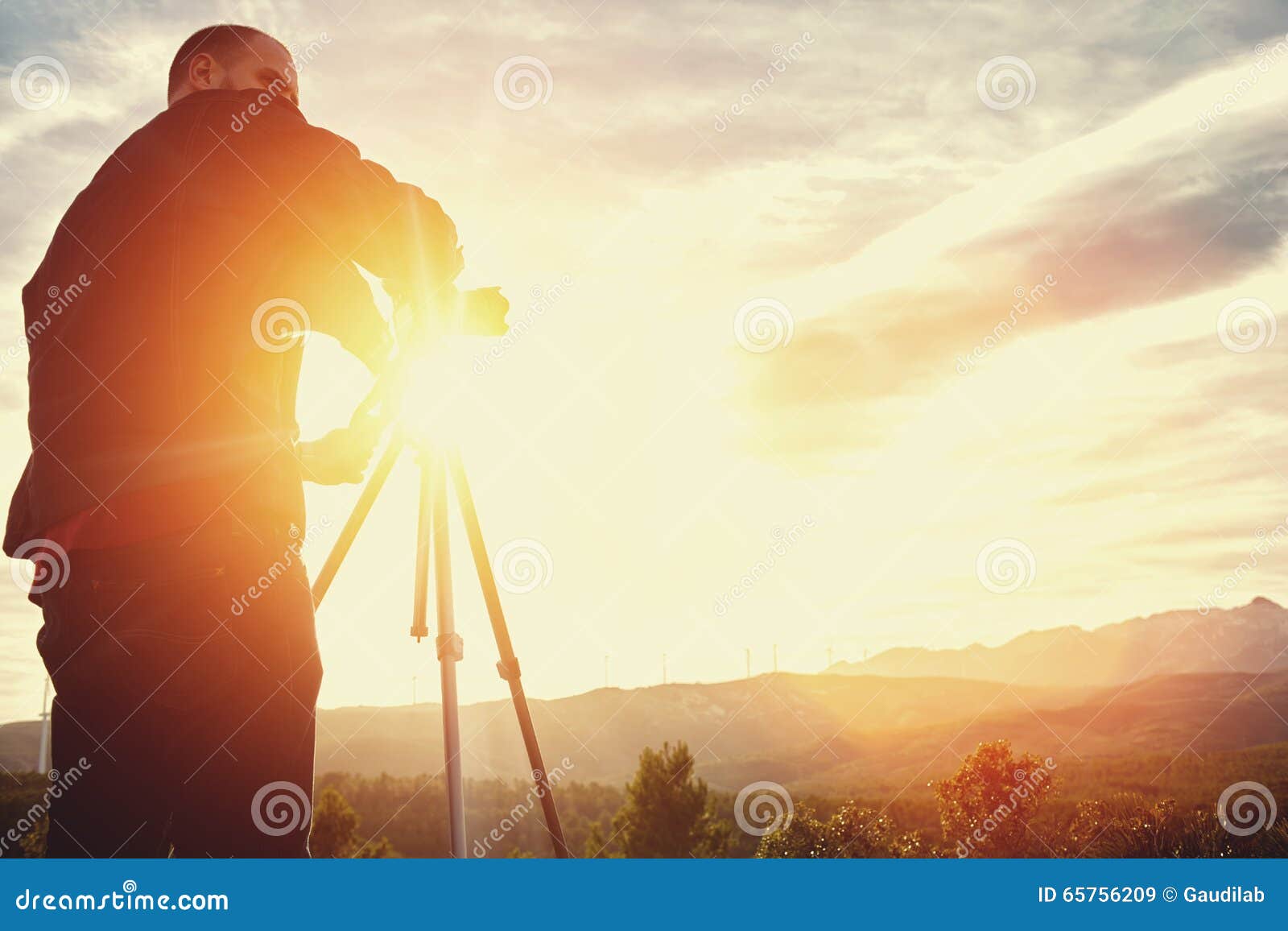 Silhouette of a Man Geodesist Using Theodolite for Determines the ...