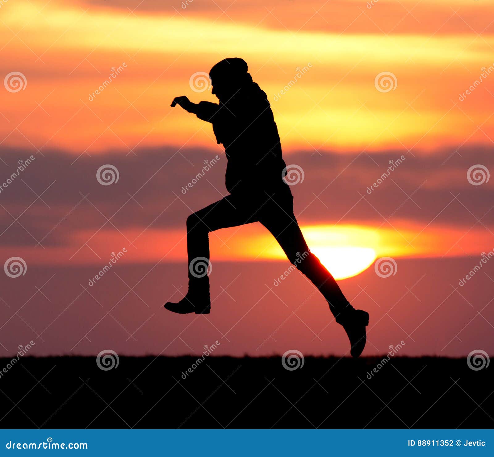 Silhouette of Man Jumping in Sunset Stock Photo - Image of human ...