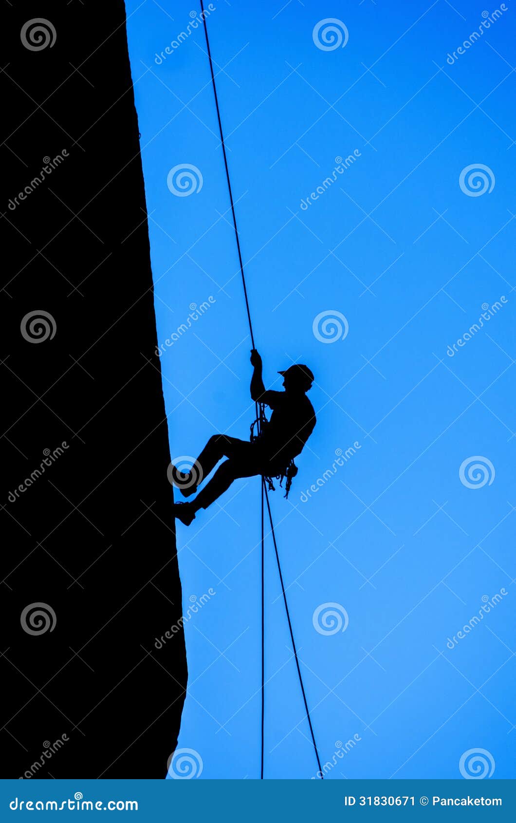 Silhouette Of Man Rappelling Stock Image - Image of black, rock: 31830671