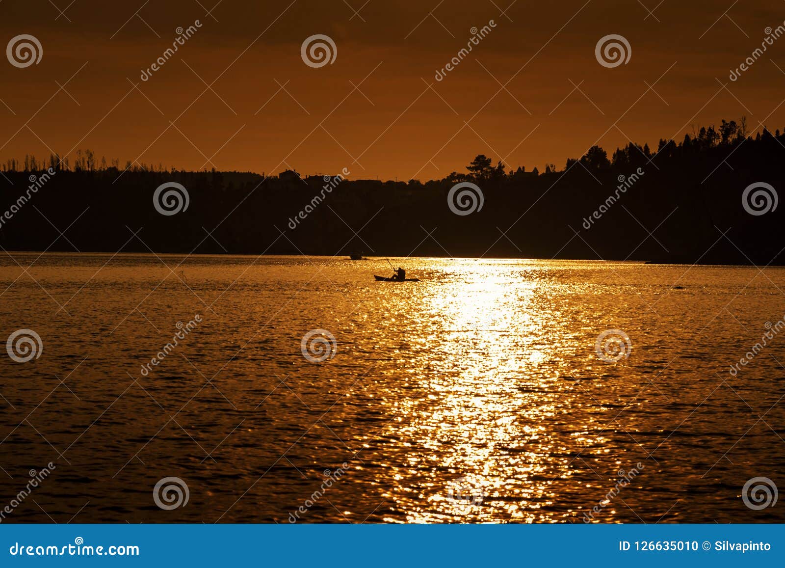 Silhouette of Man Rowing on the River with Kayak. Sunset Stock Photo ...