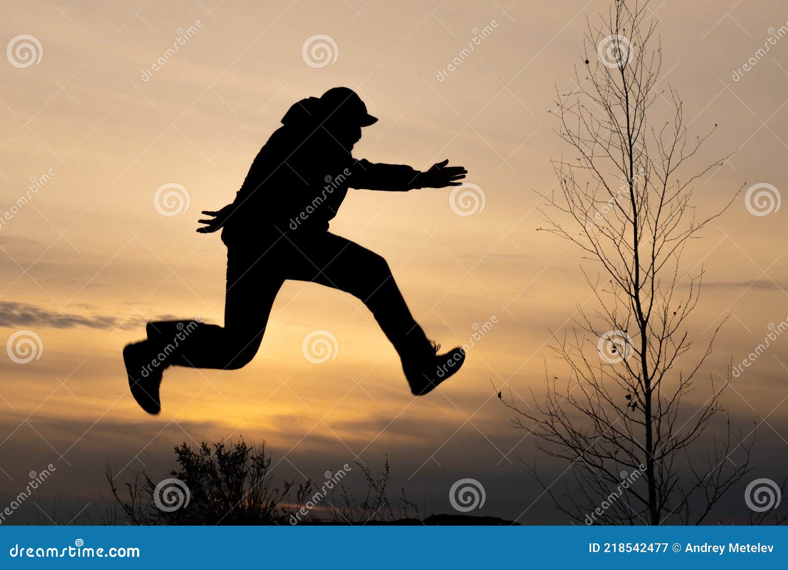 Silhouette Of A Man Running In Flight And Silhouette Of A Tree Without ...
