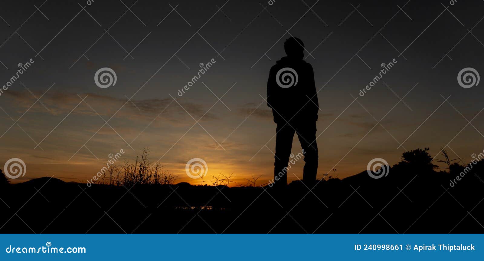 Silhouette of a Man Standing at Sunset Stock Image - Image of horizon ...