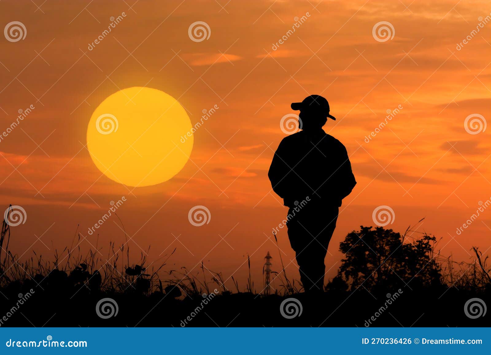 Silhouette of Man Standing at Sunset in Nature. Big Round Sun in ...