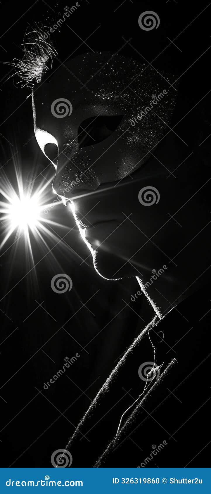 Silhouette of a Man Wearing a Theatrical Mask Hidden in Darkness with a ...