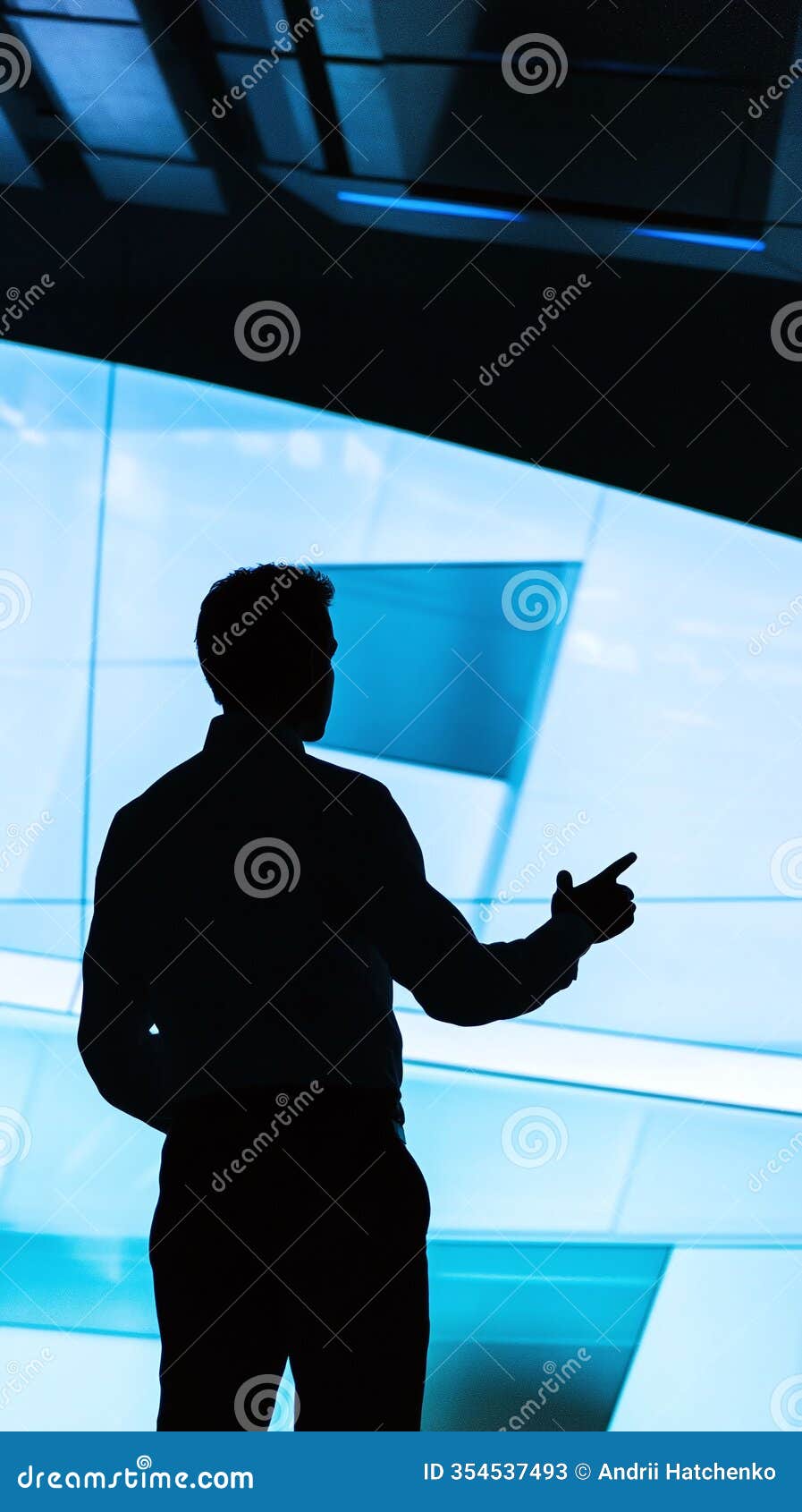 Silhouette of a Manager Presenting Logistics Solutions in a Futuristic ...