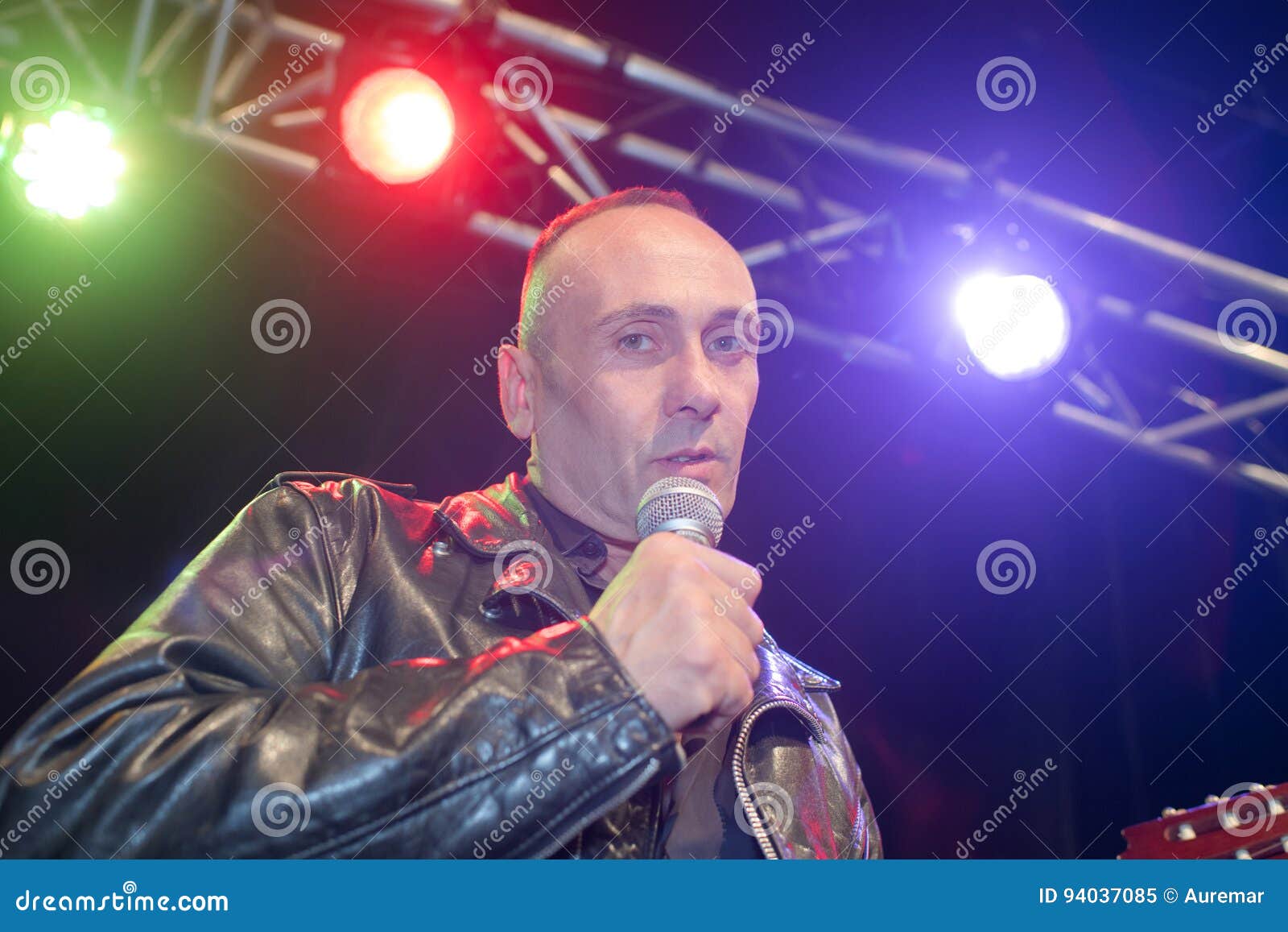 Silhouette Men Singing on Stage Under Colored Lights Stock Image ...