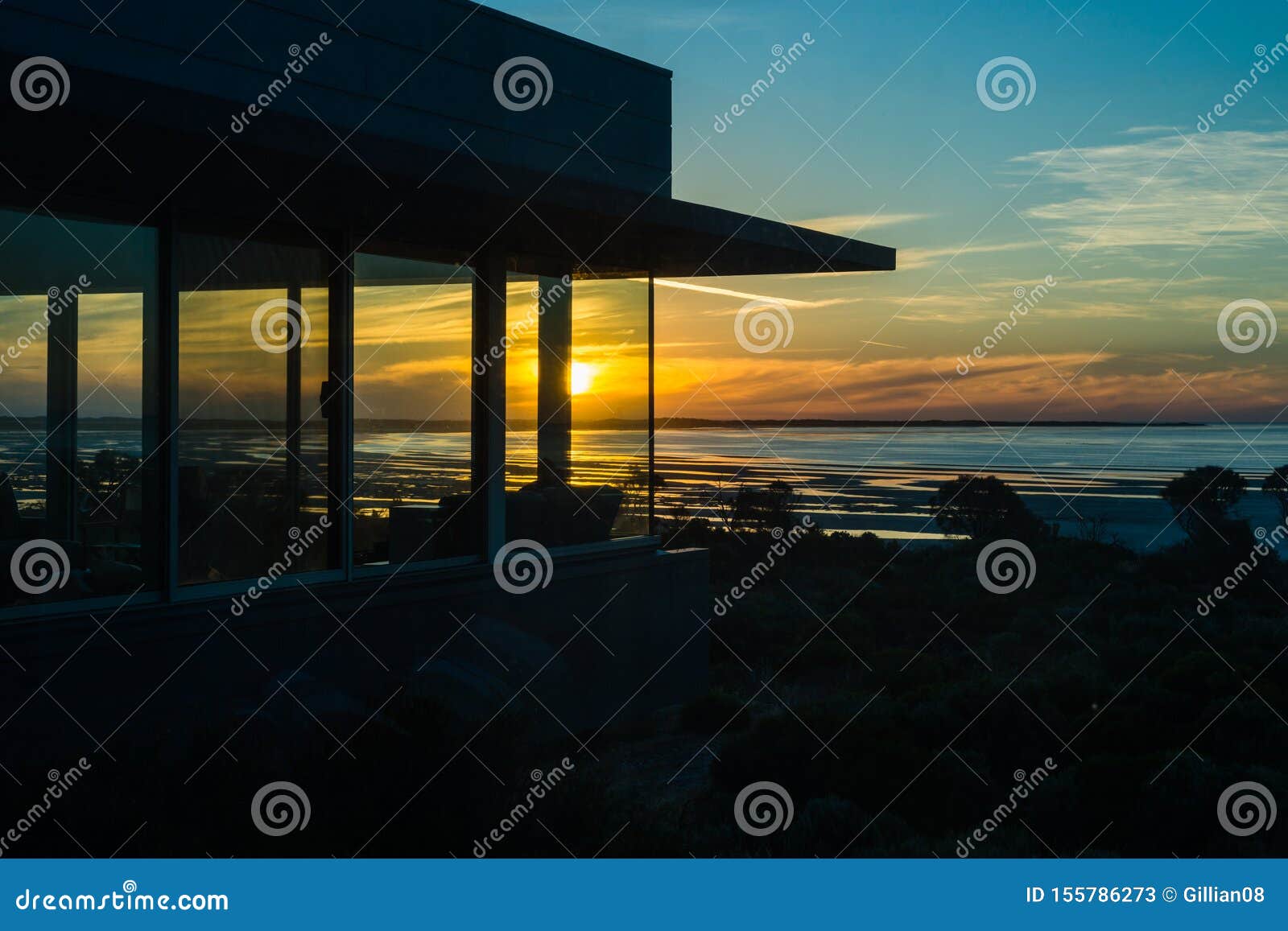 Modern Beach House Overlooking an Ocean Sunset Stock Image - Image of ...