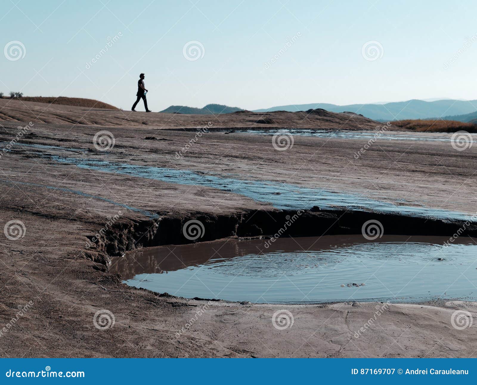 Silhouette on mud fields stock image. Image of fields - 87169707
