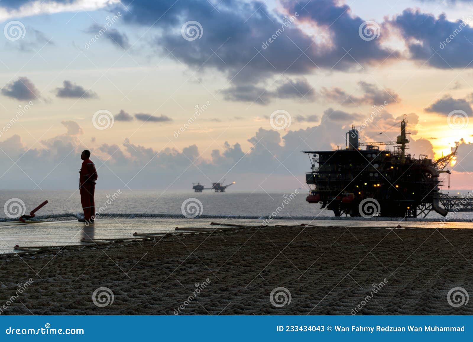 An Offshore Oil Rig Worker Wearing Personal Protective Equipment And ...