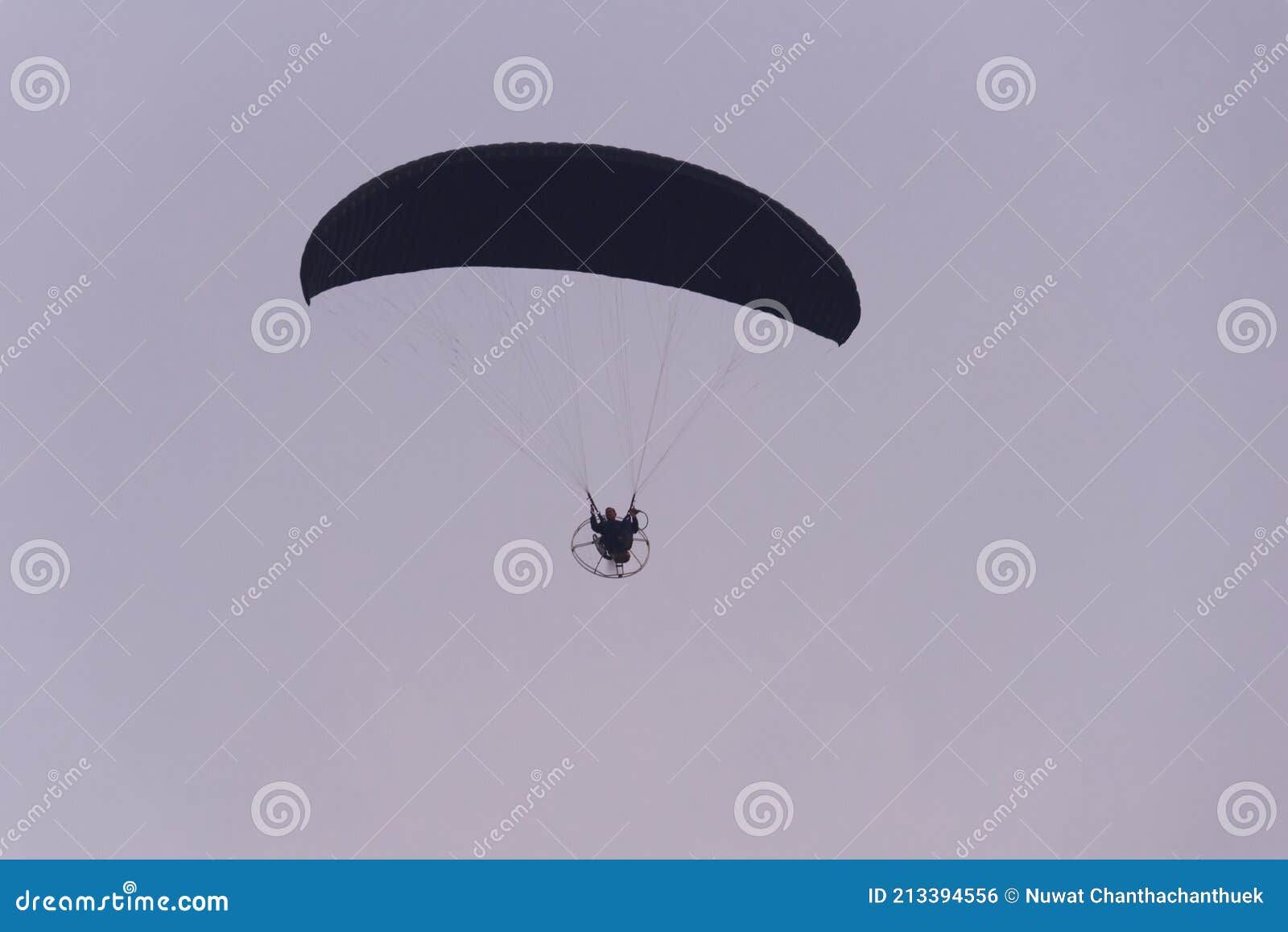 Silhouette of the Paramotor Gliding and Flying in the Air through Soft ... Silhouette of the Paramotor Gliding and Flying in the Air through Soft ...