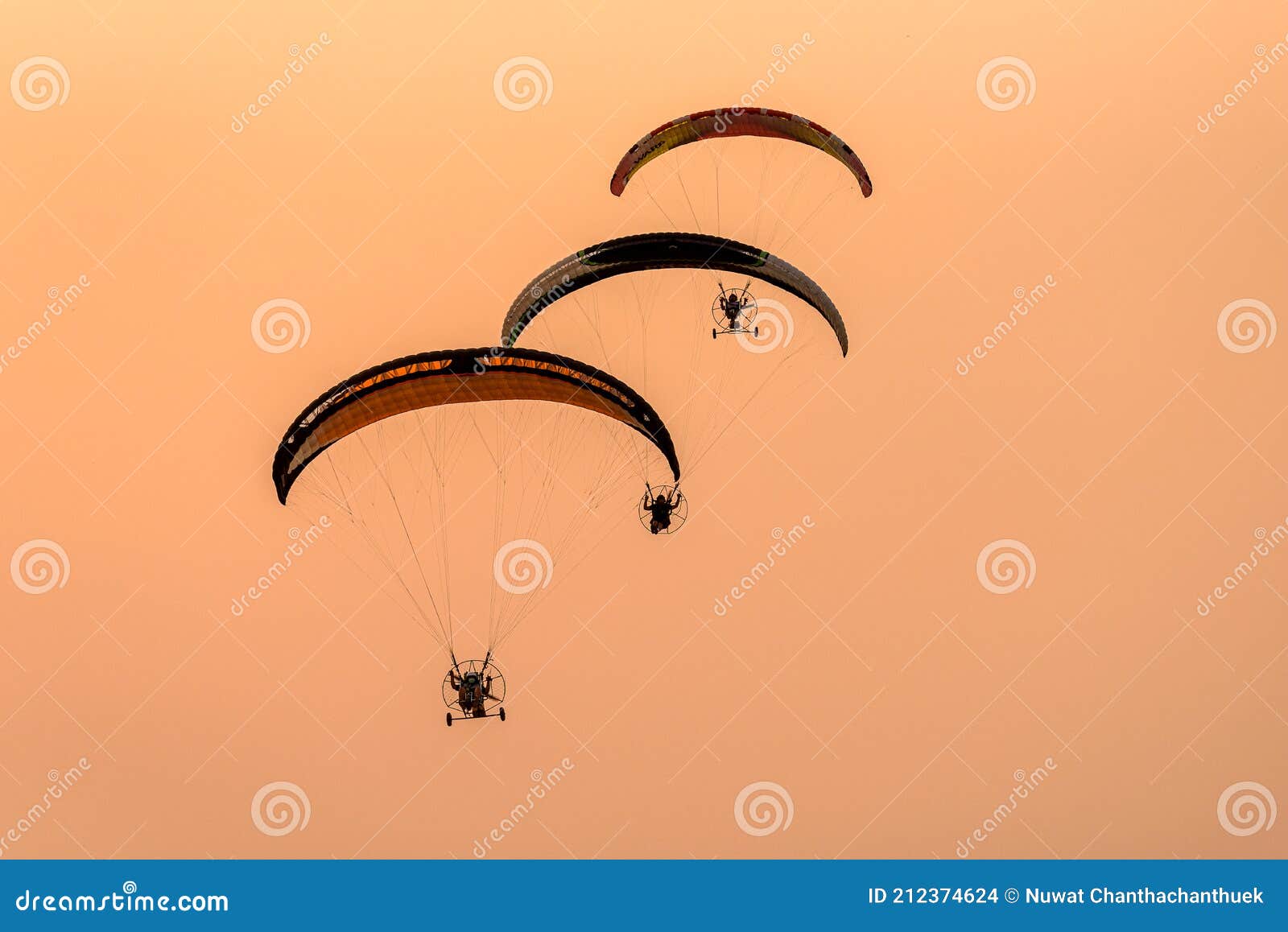 Silhouette of the Paramotor Gliding and Flying in the Air through Soft ... Silhouette of the Paramotor Gliding and Flying in the Air through Soft ...