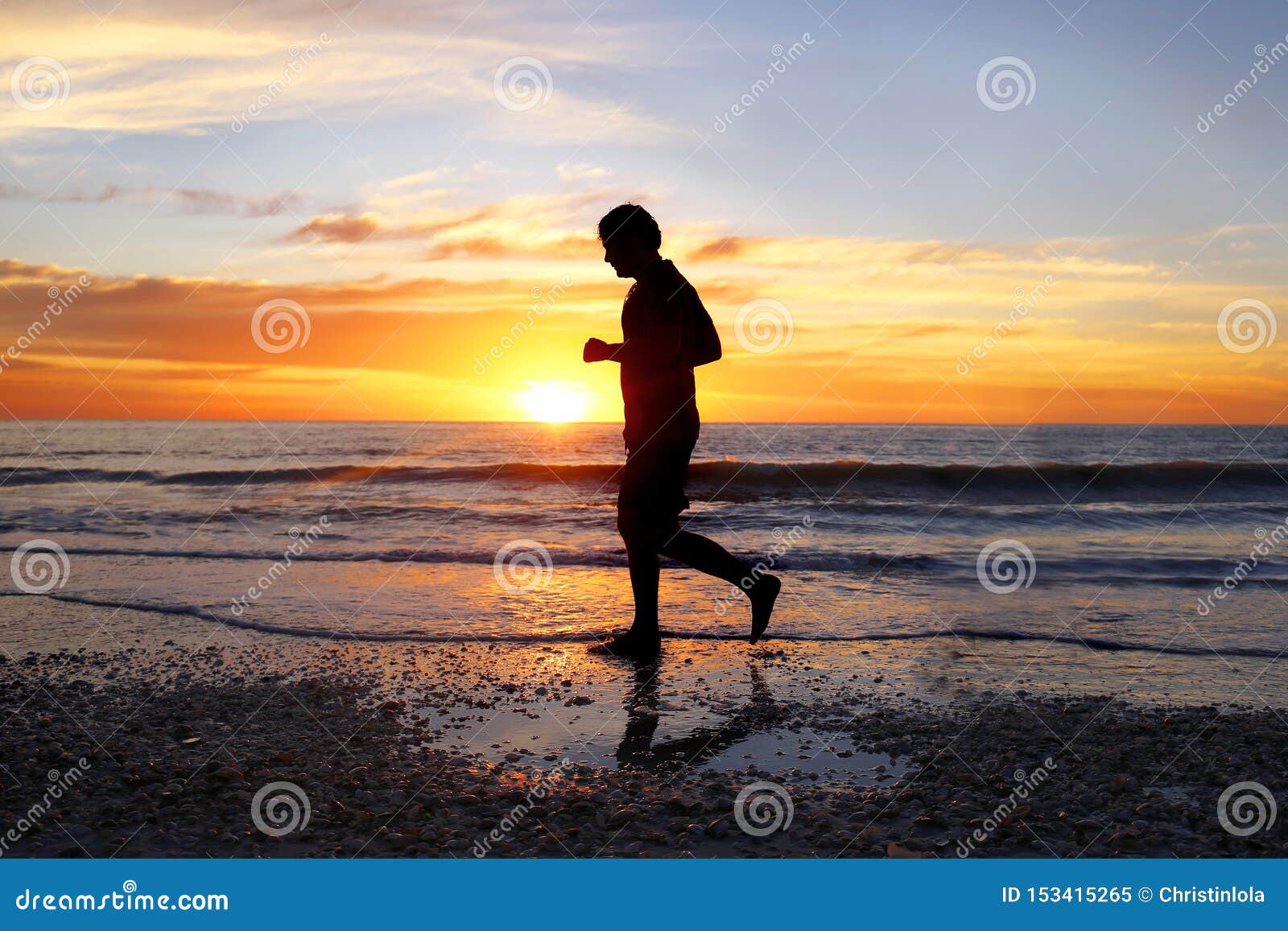 Silhouette of Peaceful Man Running Alone on Beach at Sunset Stock Image ...