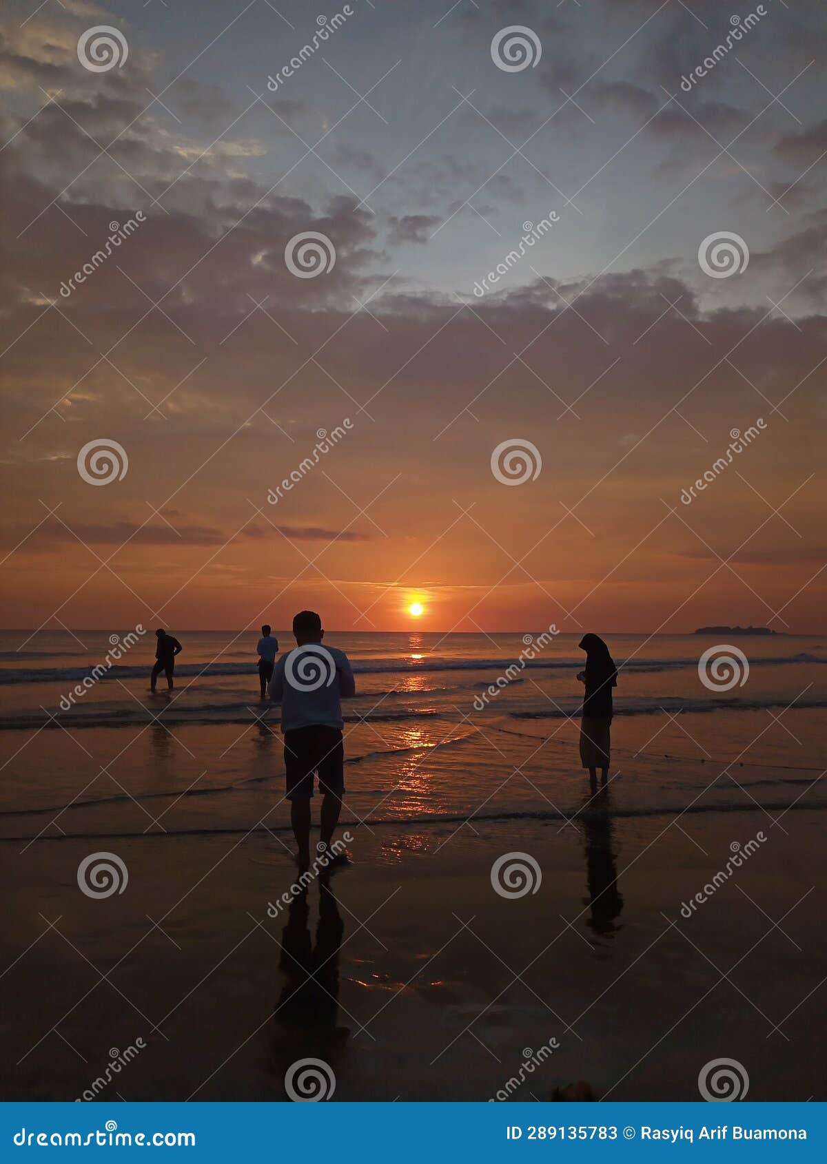 The Silhouette of the People Interacting during the Sunset at the Beach ...