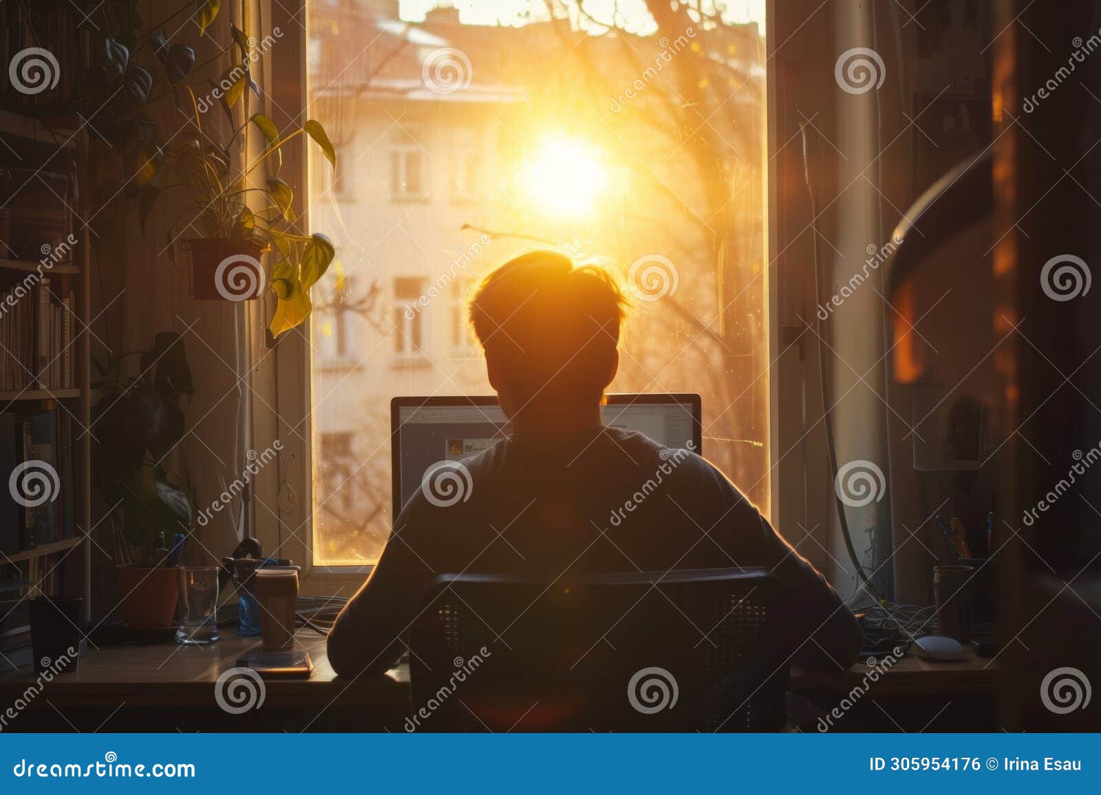 Silhouette of Person at Computer during Sunset Stock Photo - Image of ...