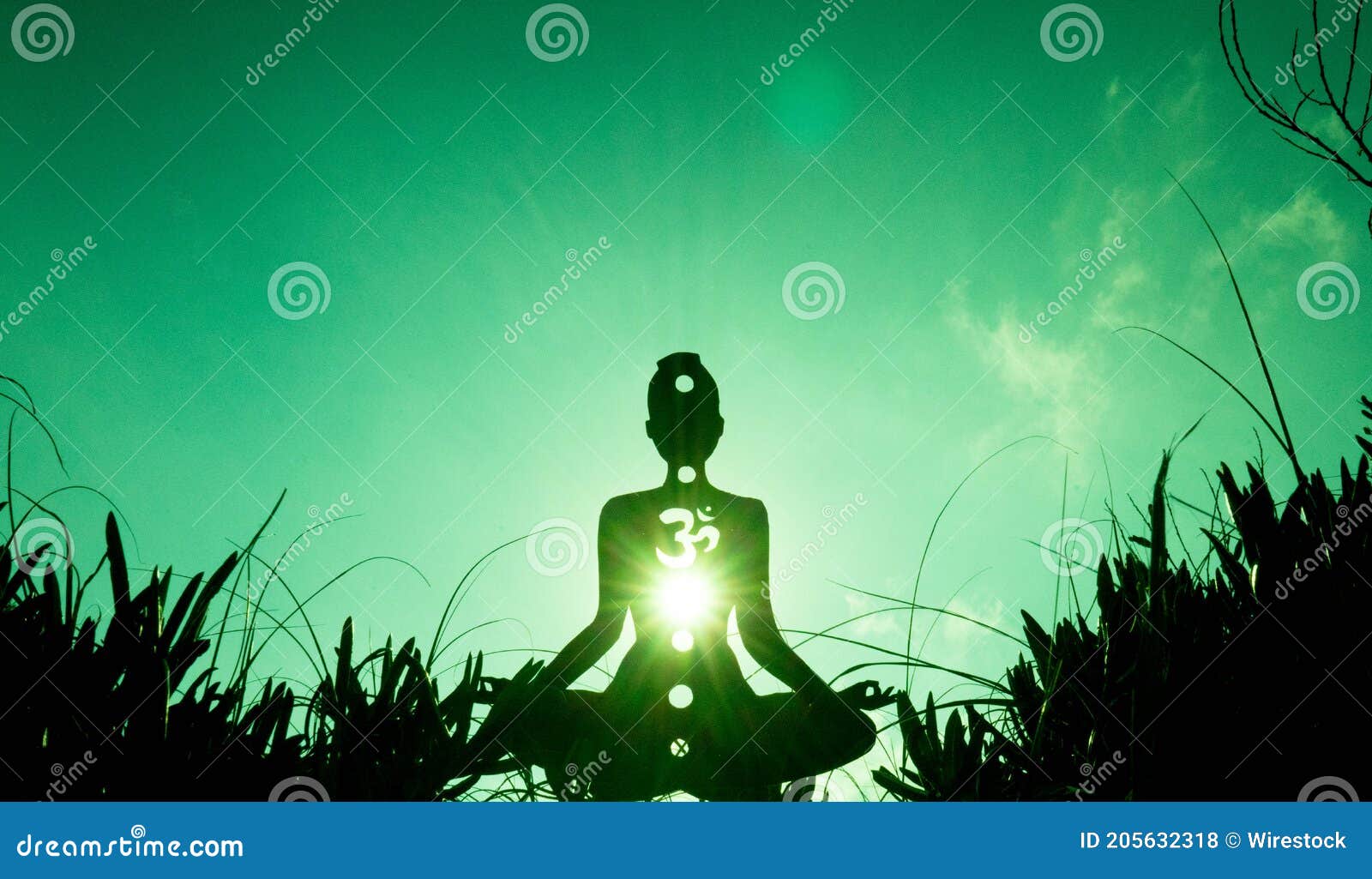Silhouette of a Person Meditating with an Open Heart Chakra Under the ...