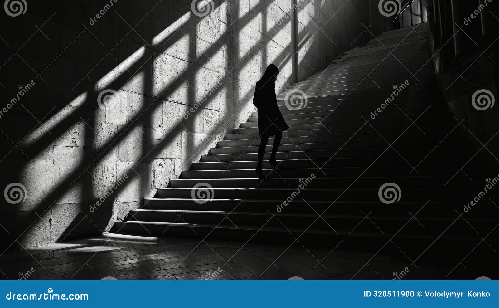 Silhouette of a Person Walking Up a Staircase Illuminated by Window ...