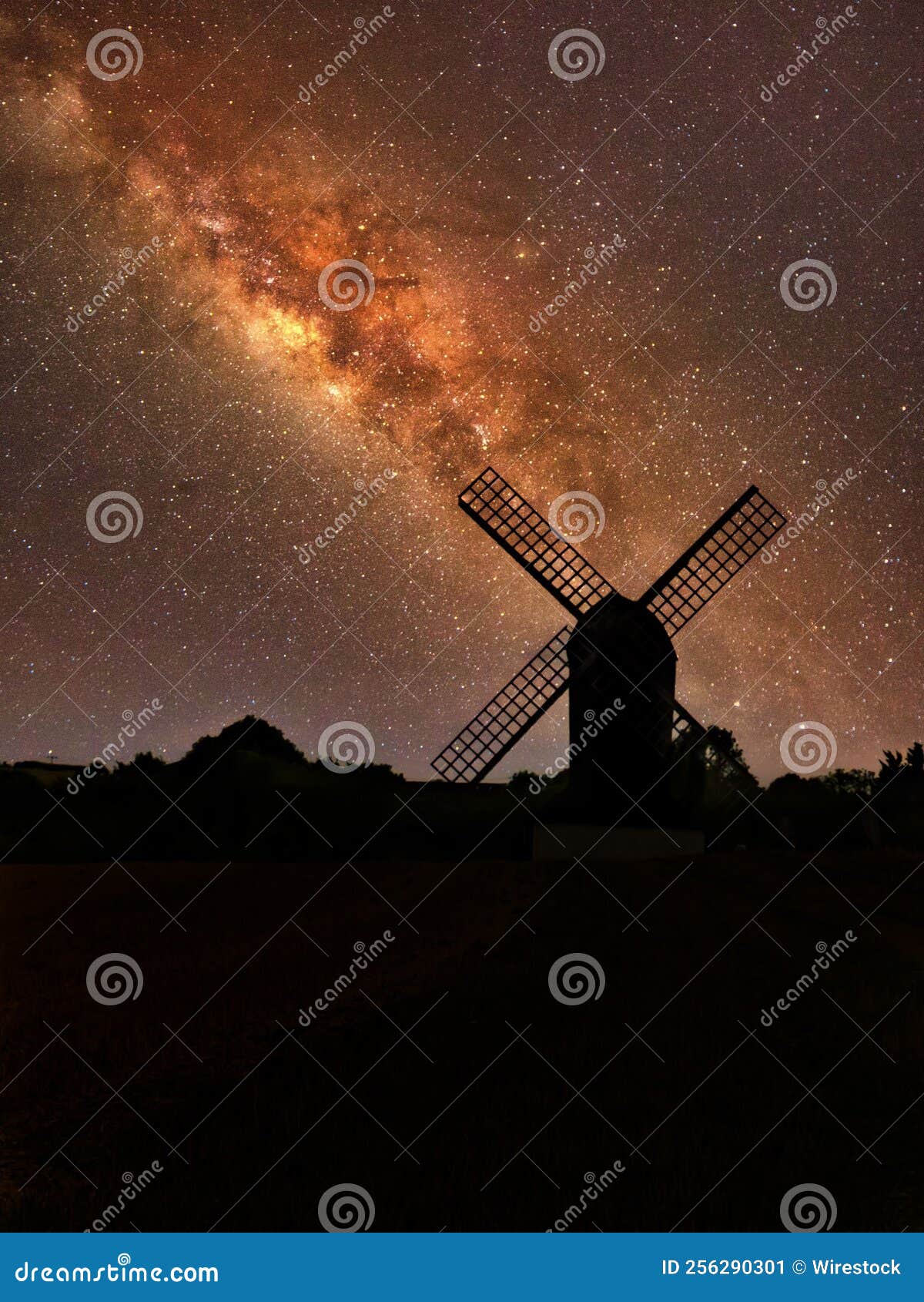 Silhouette of a Pit Stone Windmill on a Field Under a Starry Night ...