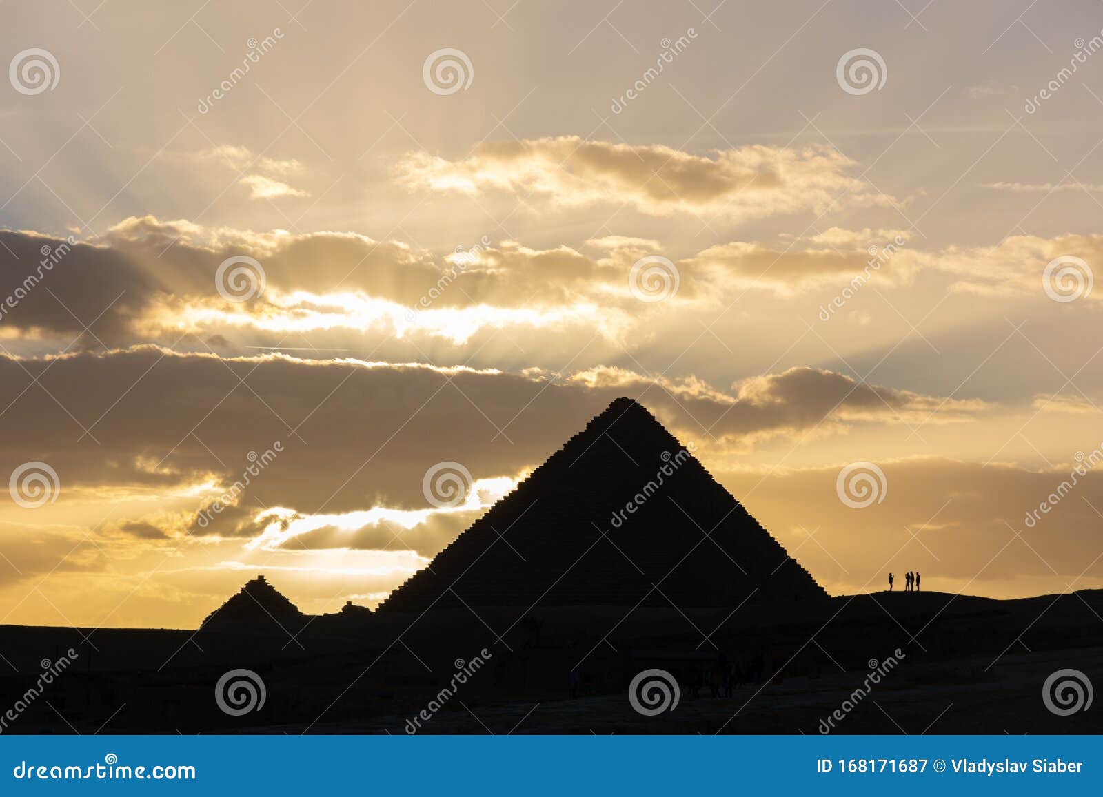 Silhouette of Pyramid of Menkaure and Several People in Front of Sunset ...