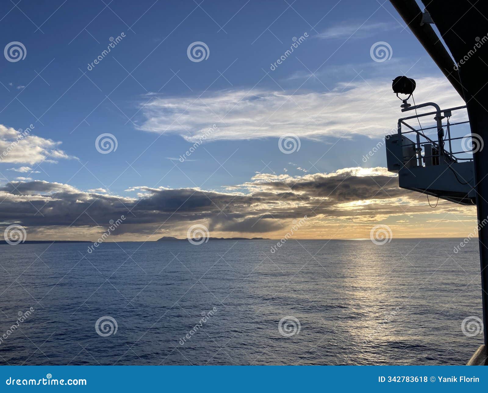 Silhouette of a Ships Bridge Wing with the Sun Setting in a Calm Ocean ...