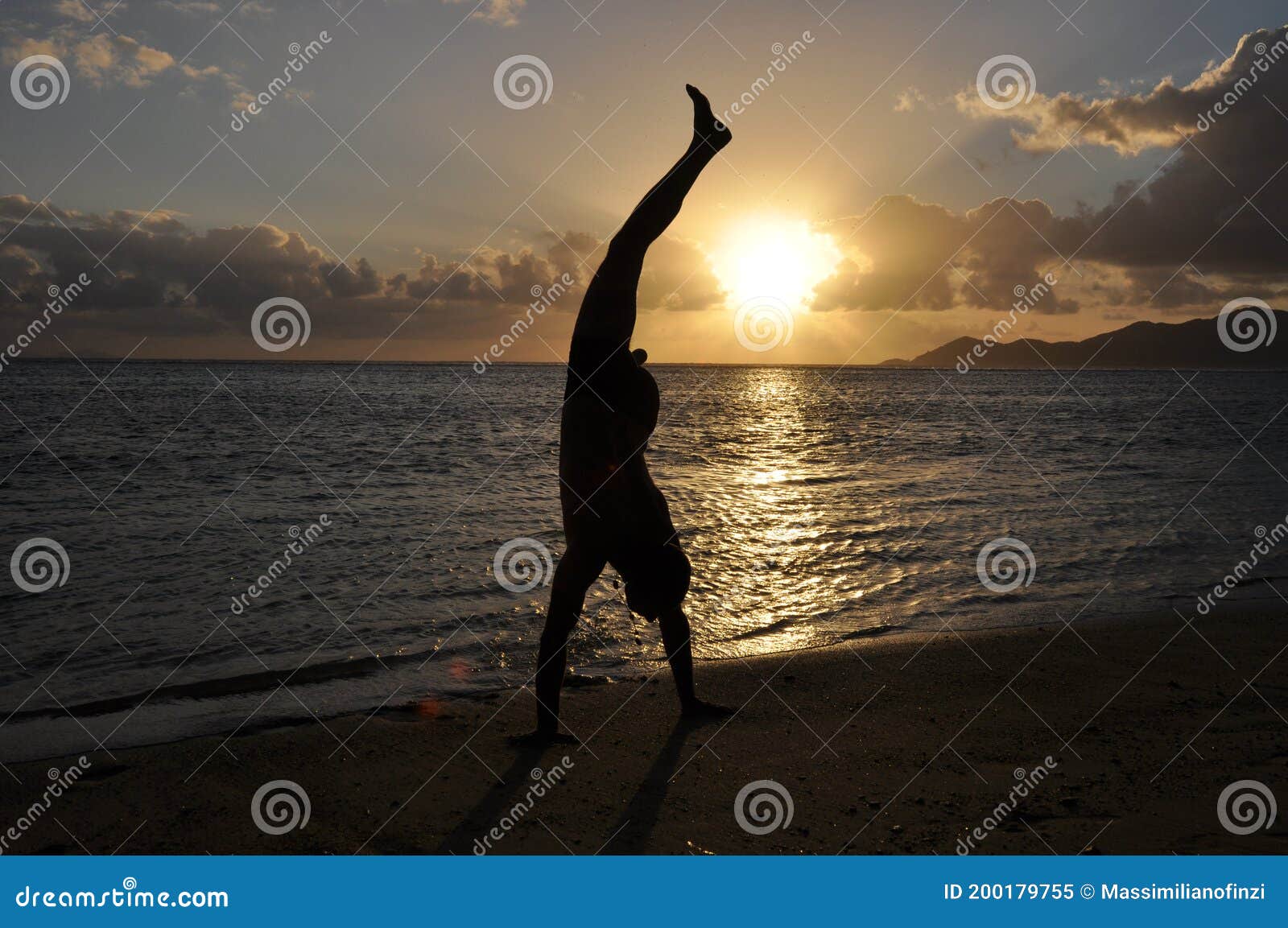 Silhouette Doing Handstand on Beach at Sunset Stock Image - Image of ...