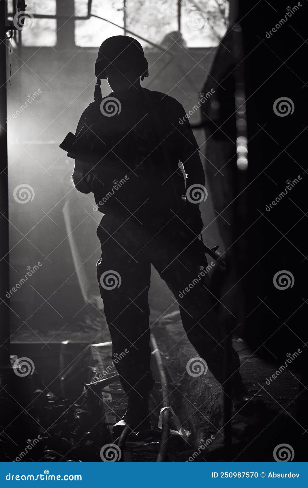 Silhouette of a Soldier in Uniform and a Helmet in a Destroyed House ...