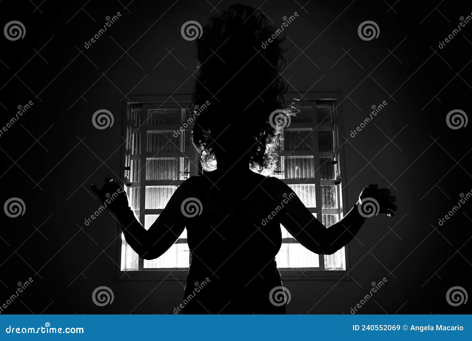 A Silhouette of Someone Backlit in Front of a Window. Stock Image ...