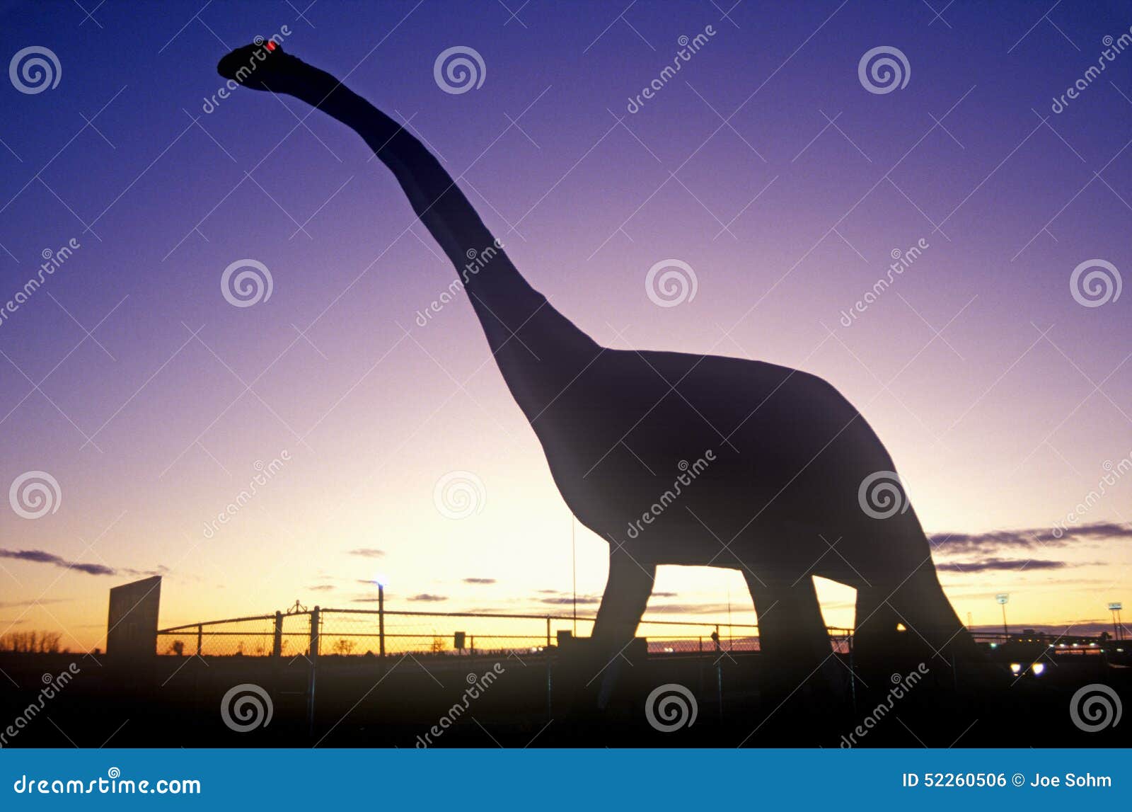 Silhouette of Statue of Brontosaurus, SD at Sunset Stock Photo - Image ...