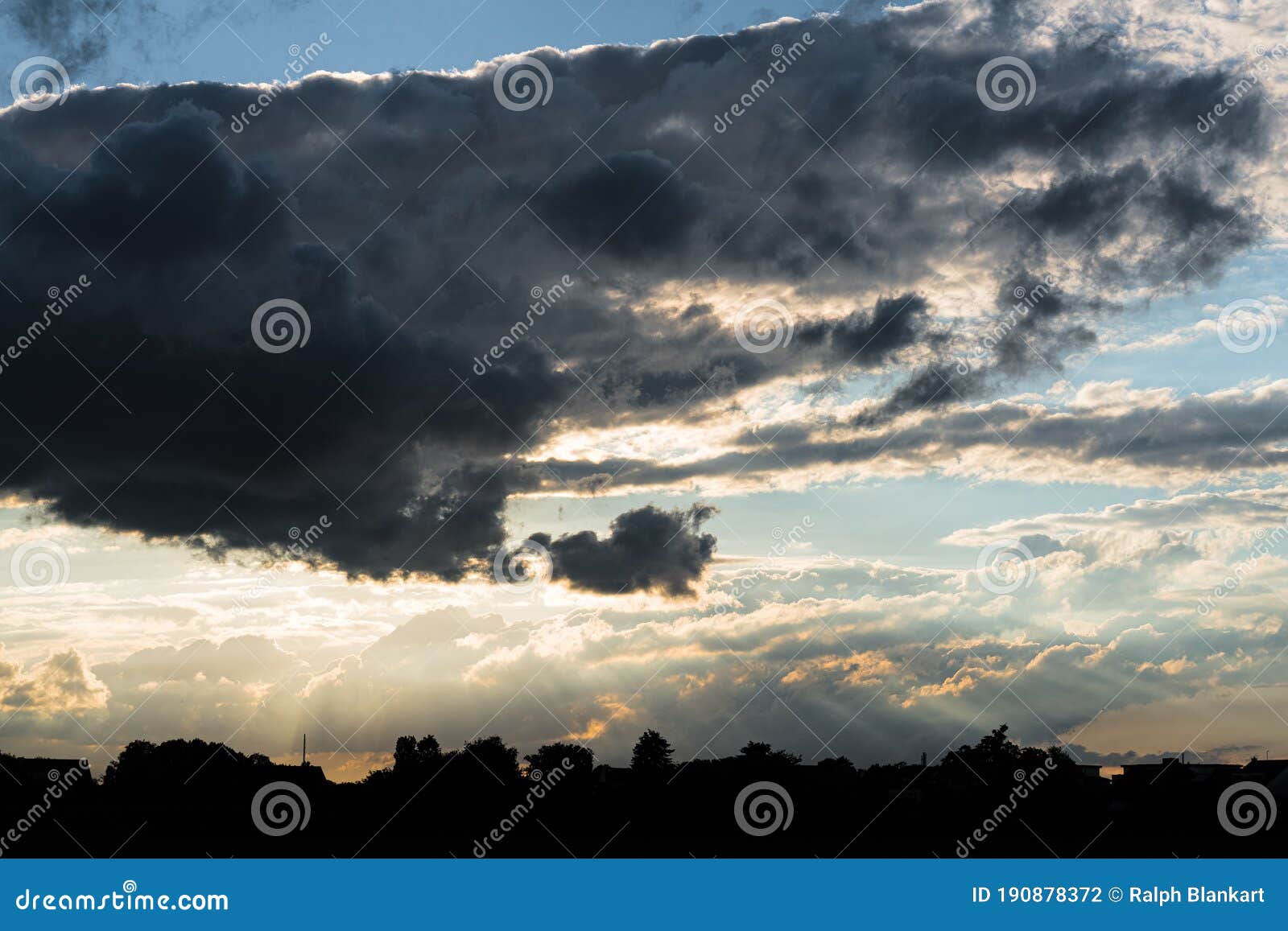 Silhouette of Suburban Scenery Under Dramatic Backlit Clouds. Stock ...