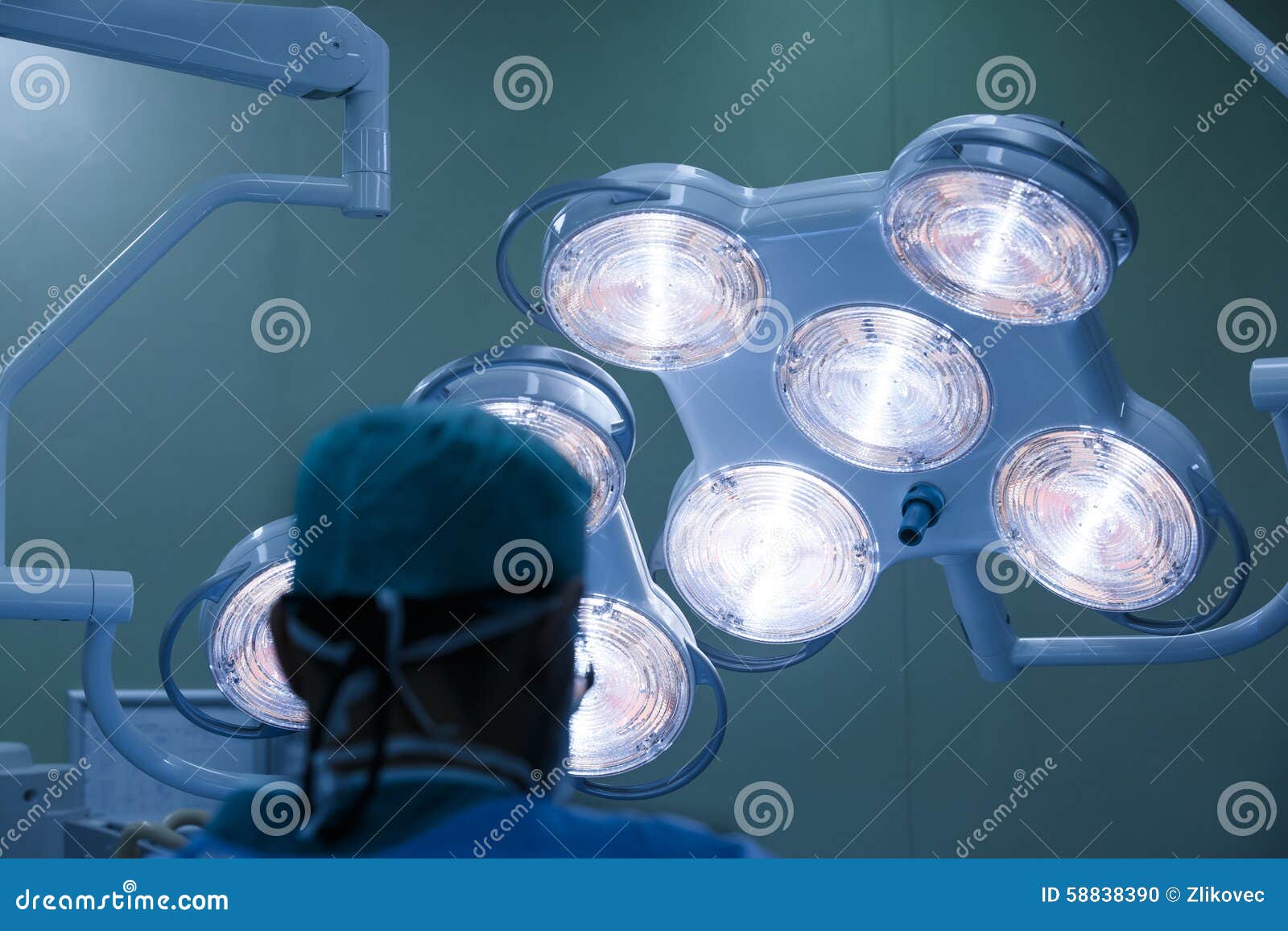 Silhouette of a Surgeon with Operating Lights in the Background Stock ...