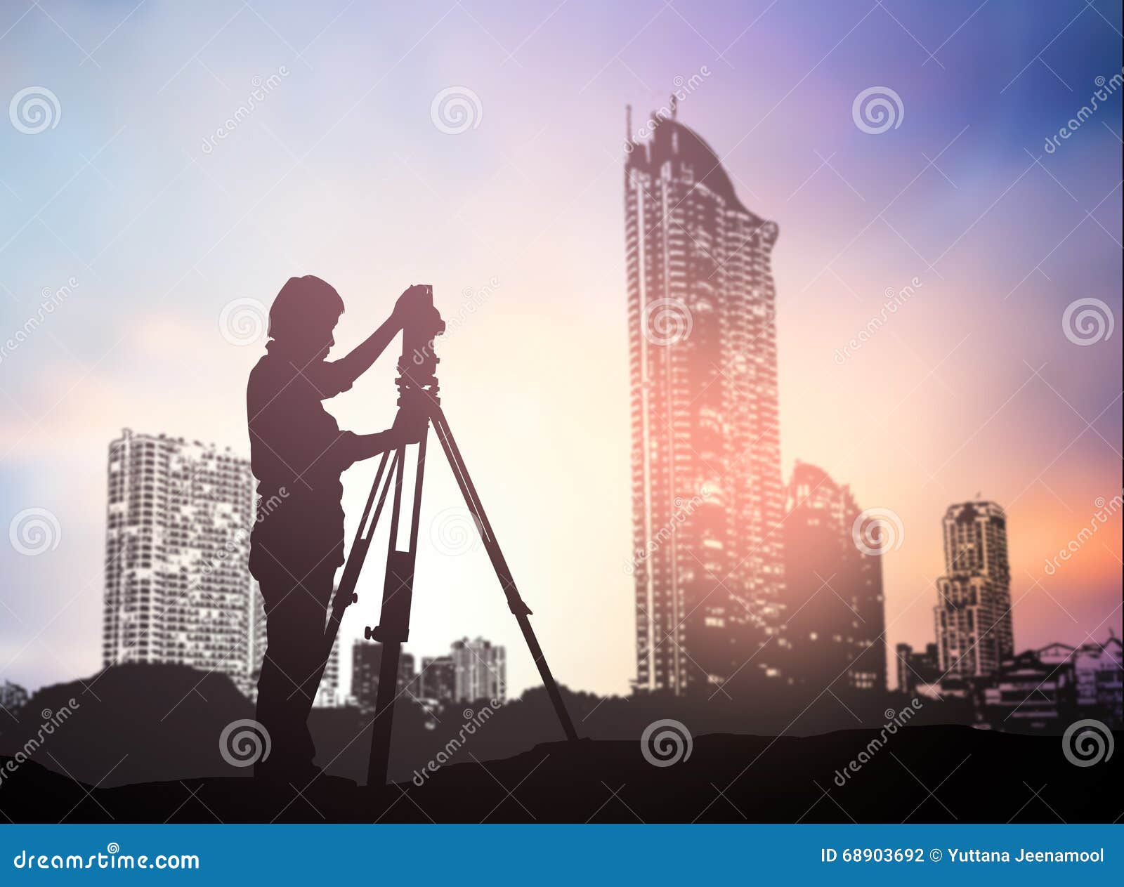 Silhouette Survey Engineer Working in a Building Site Over Blur Stock ...