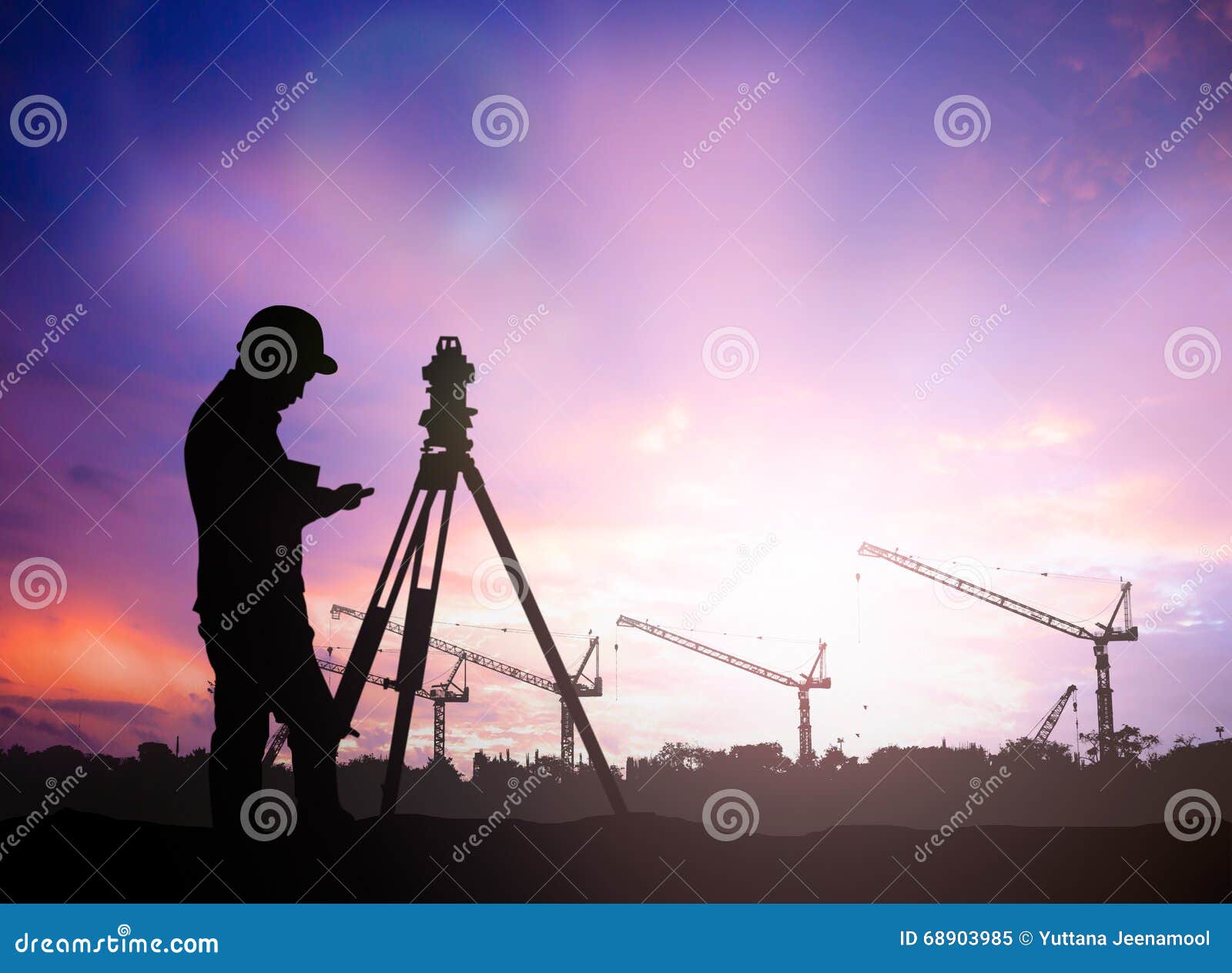 Silhouette Survey Engineer Working in a Building Site Over Blur Stock ...