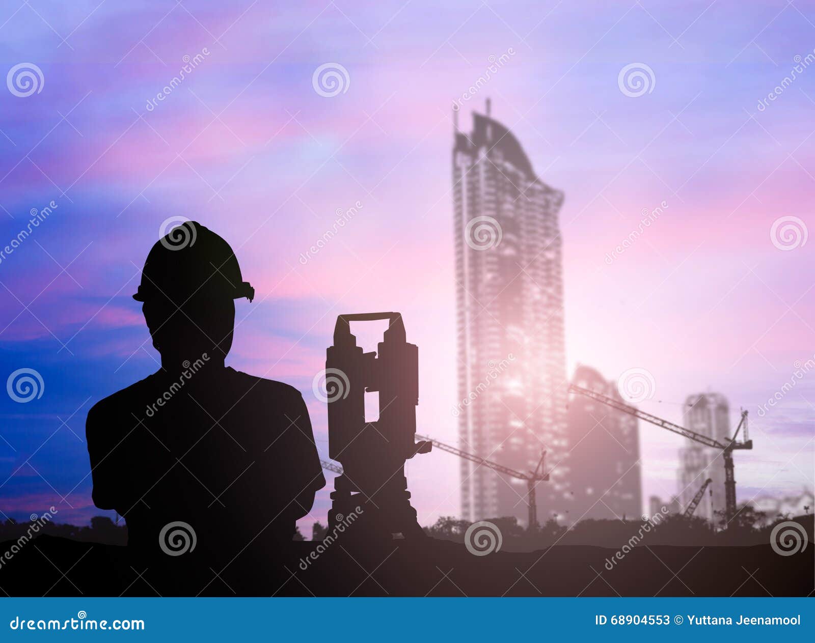 Silhouette Survey Engineer Working in a Building Site Over Blur Stock ...